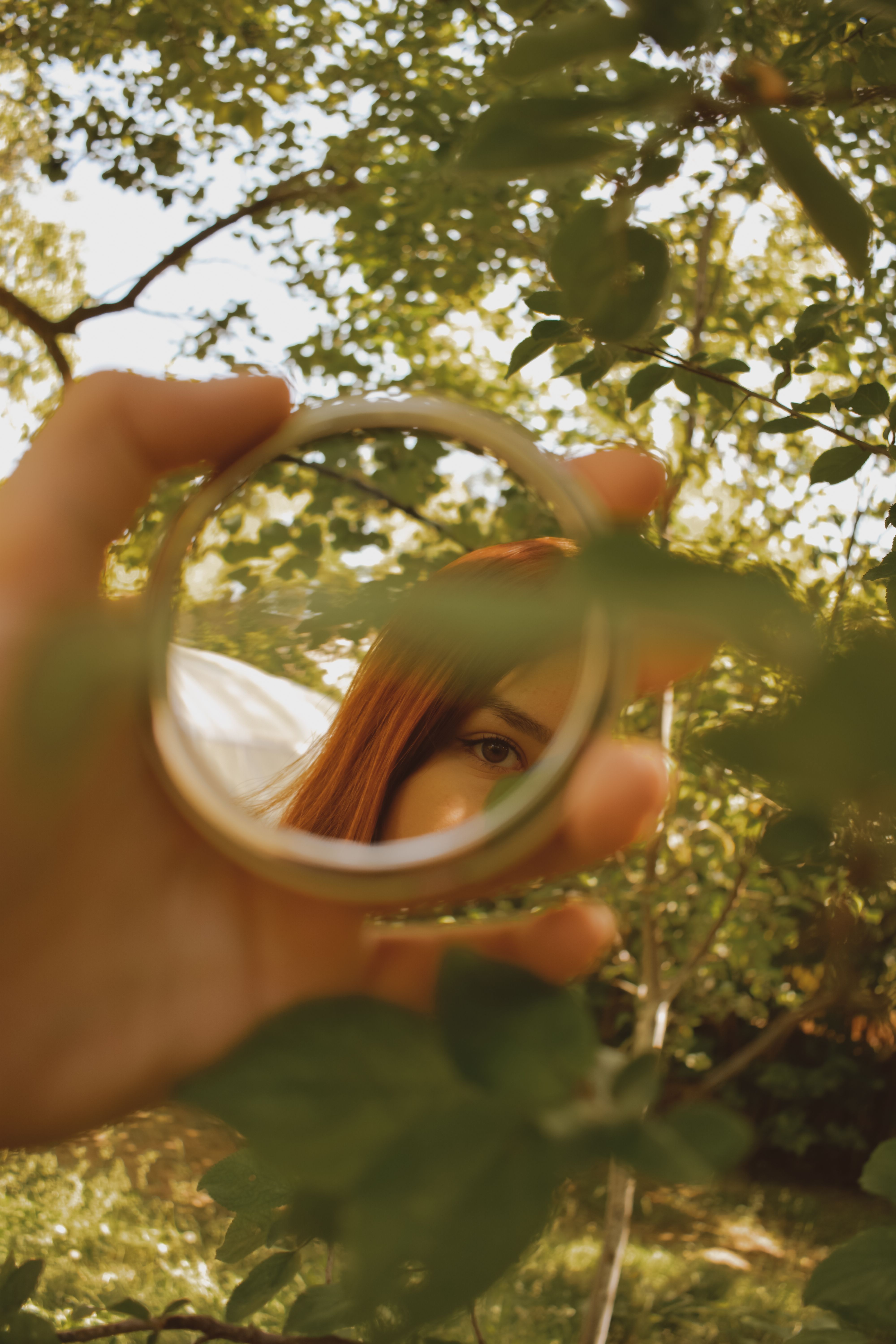 Close-Up Shot of a Person Holding a Pocket Mirror · Free Stock Photo