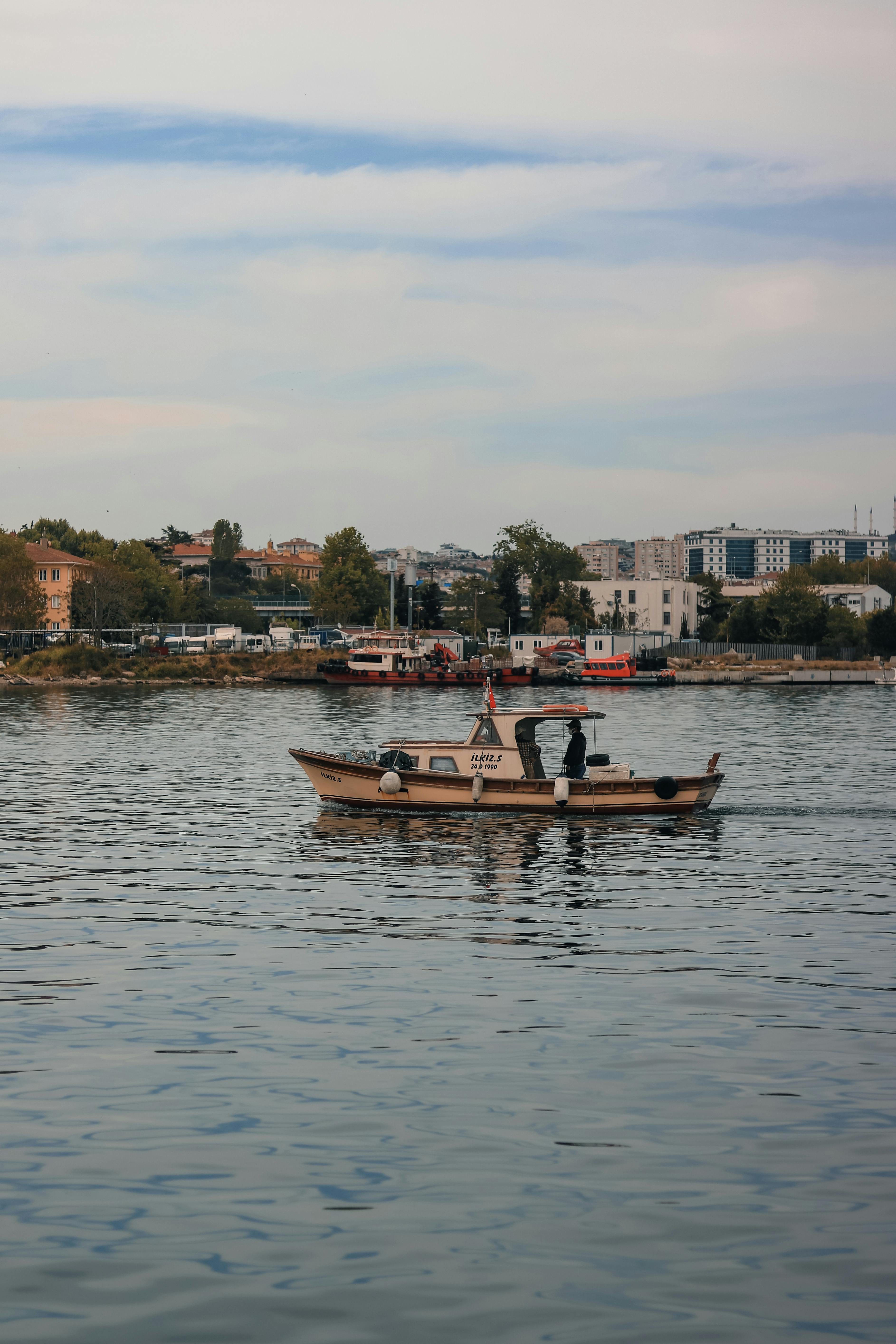 Brown Boat on Water · Free Stock Photo