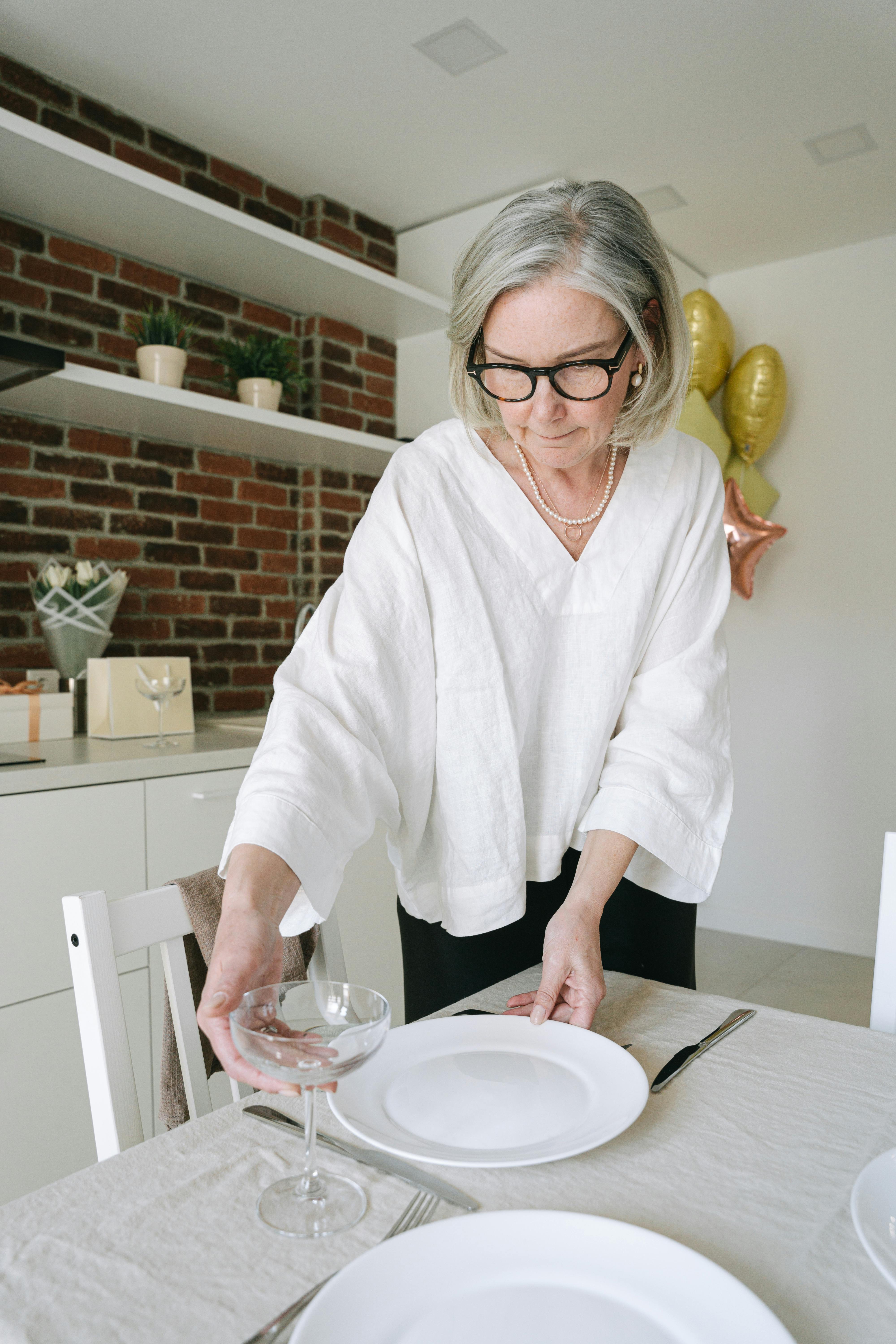 Woman Preparing a Table · Free Stock Photo