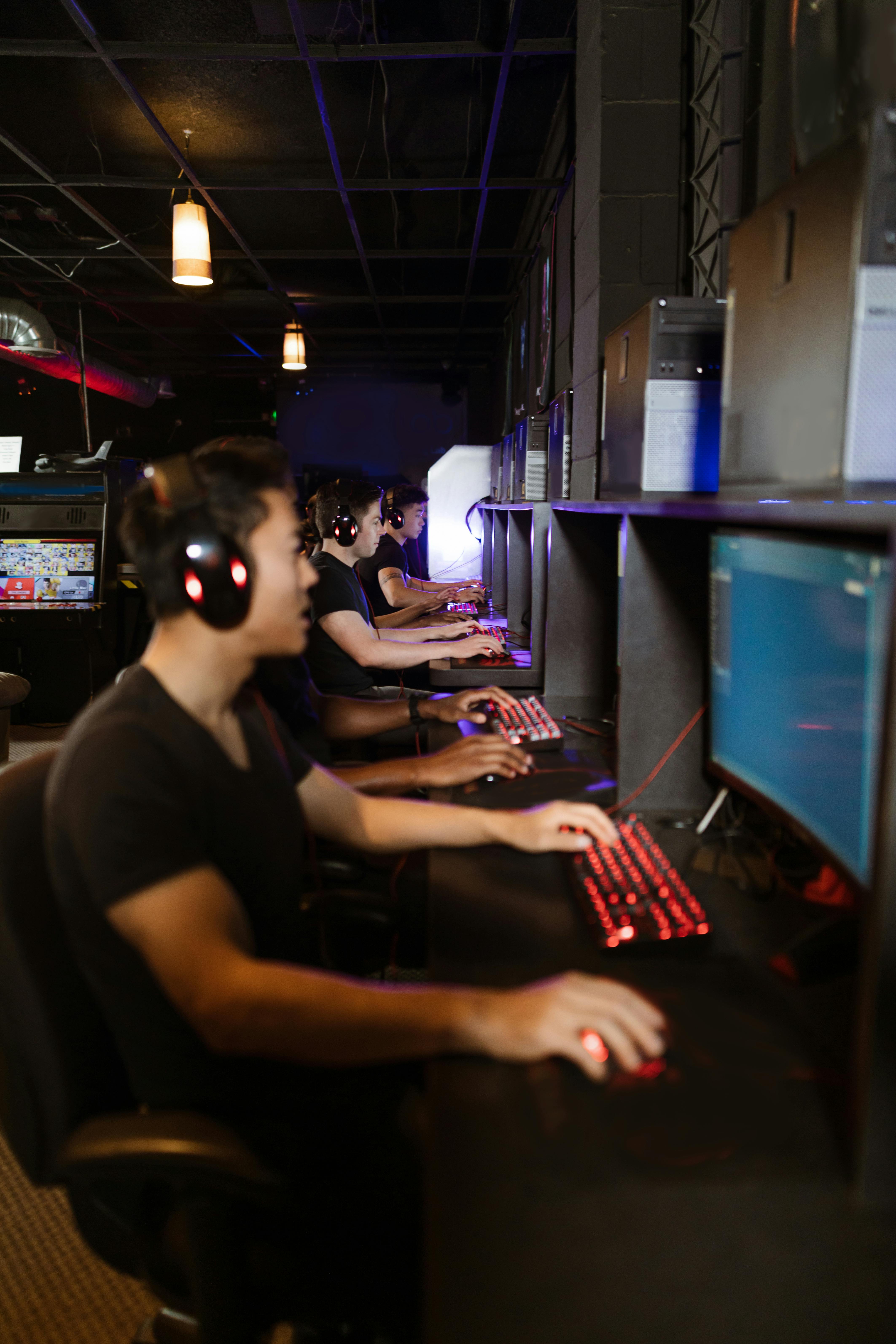 A Man Playing a Video Game in a Computer · Free Stock Photo