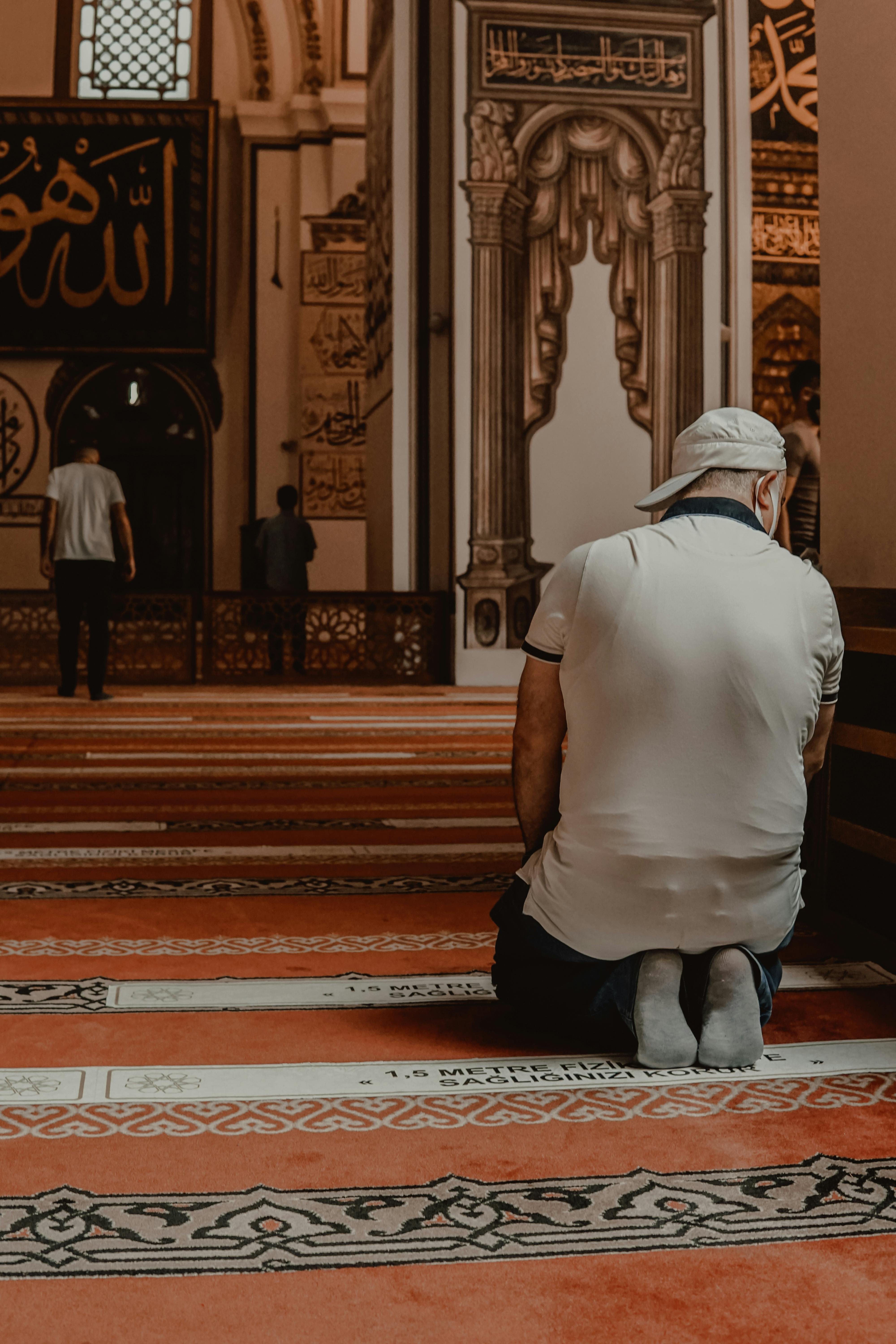 Black and White Photo of a Man Praying in a Mosque · Free Stock Photo