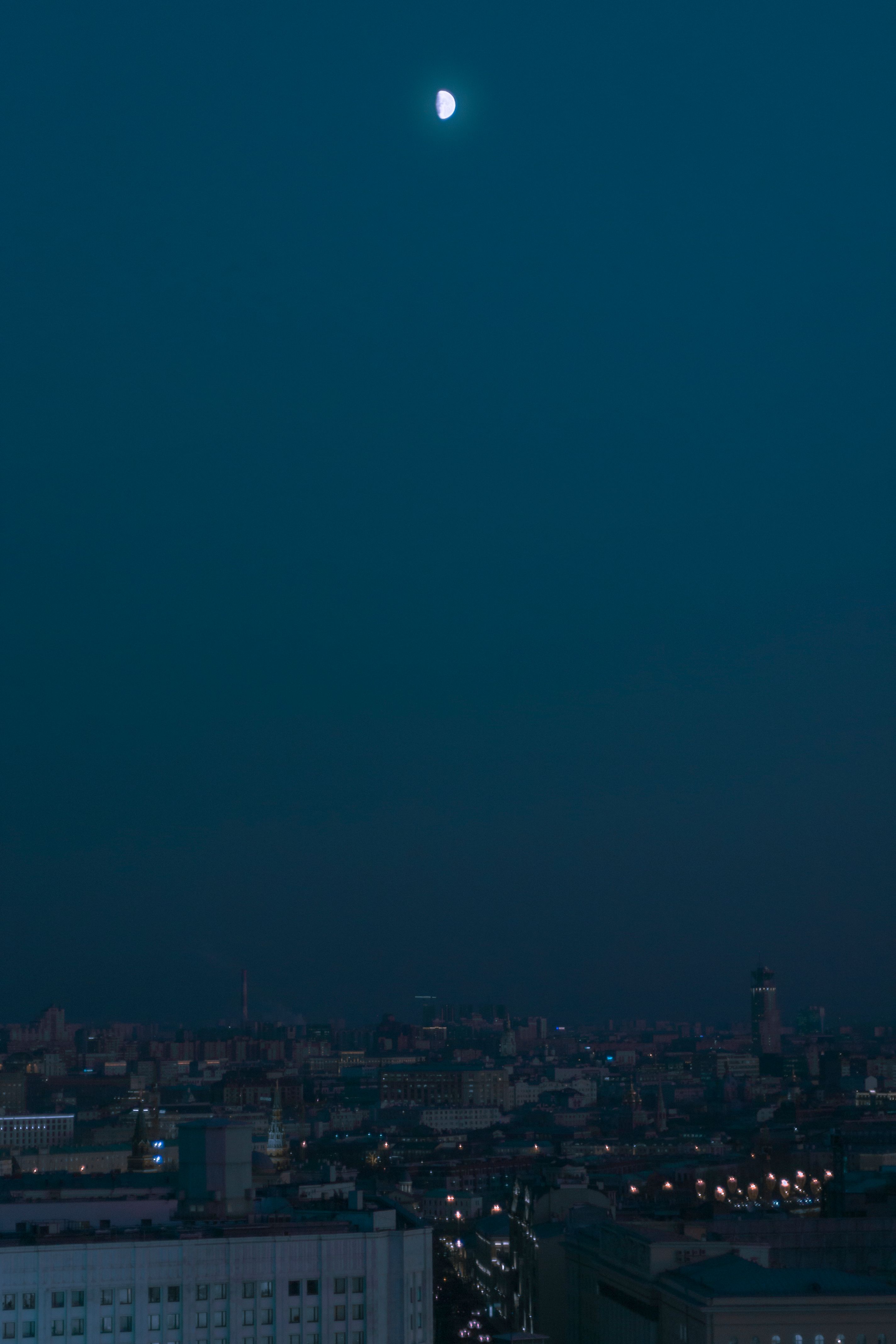 Crescent Yellow Moon over City at Night · Free Stock Photo