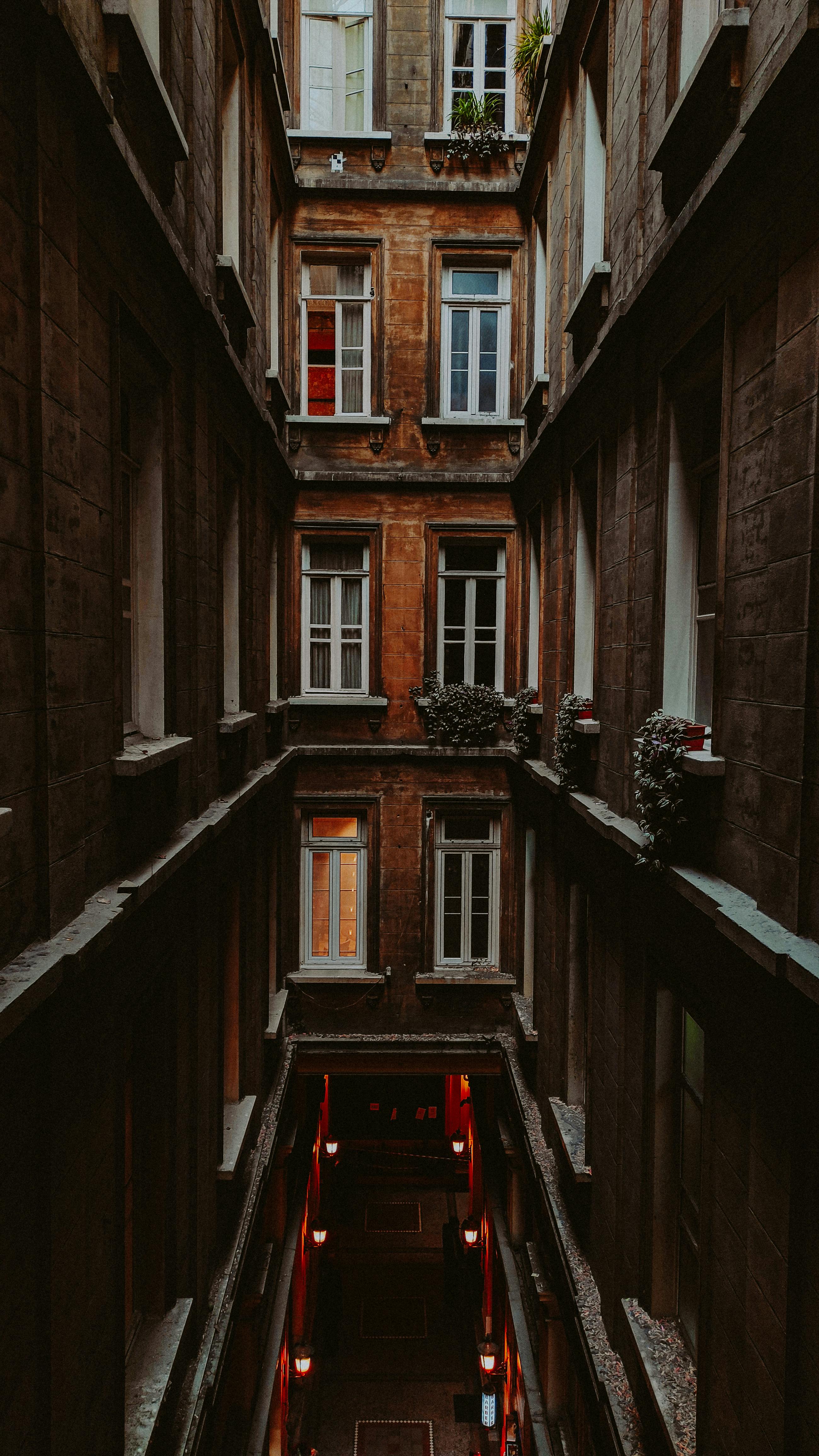 Windows along Inner Court of Old Tenement House · Free Stock Photo