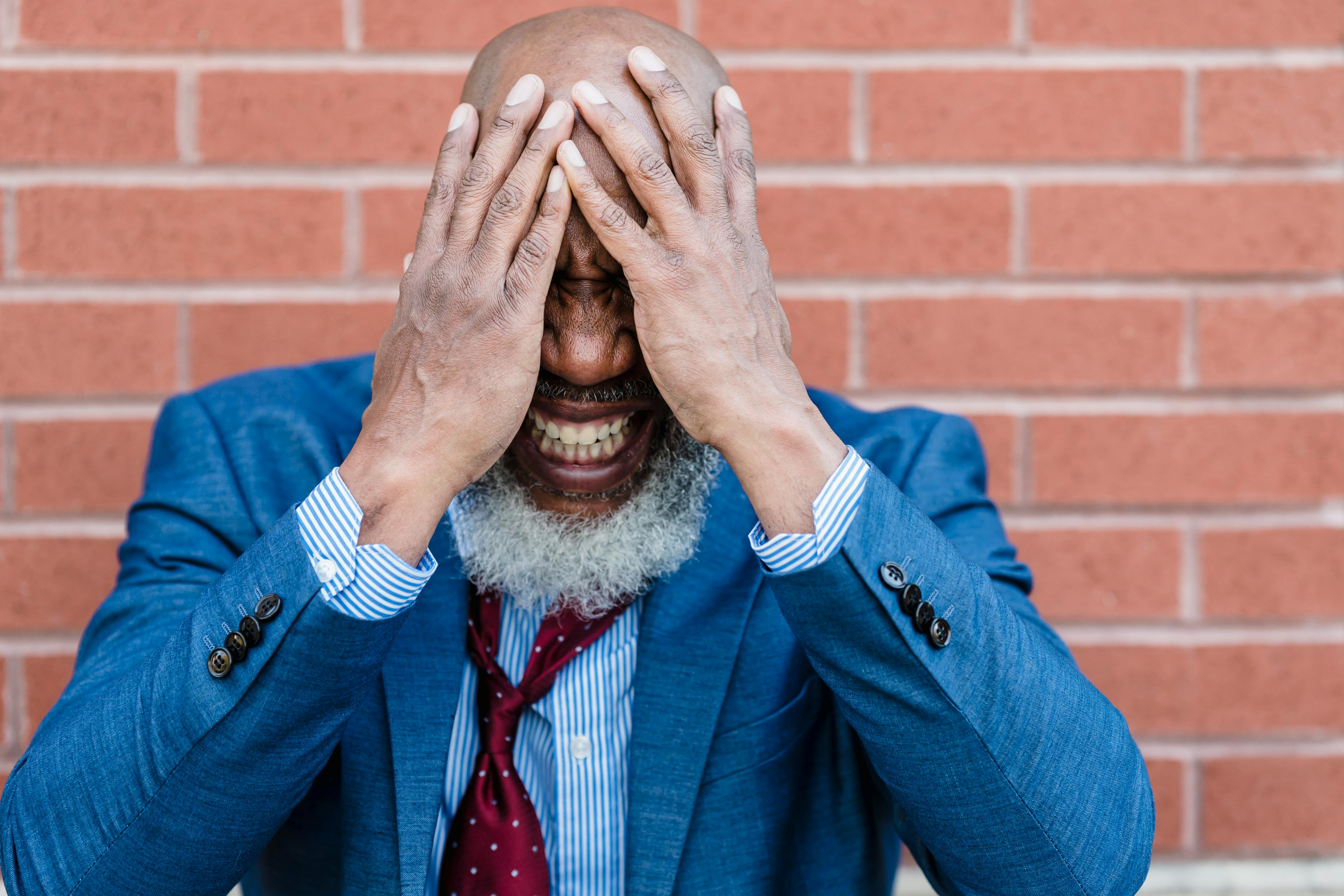 Man Covering his Face · Free Stock Photo