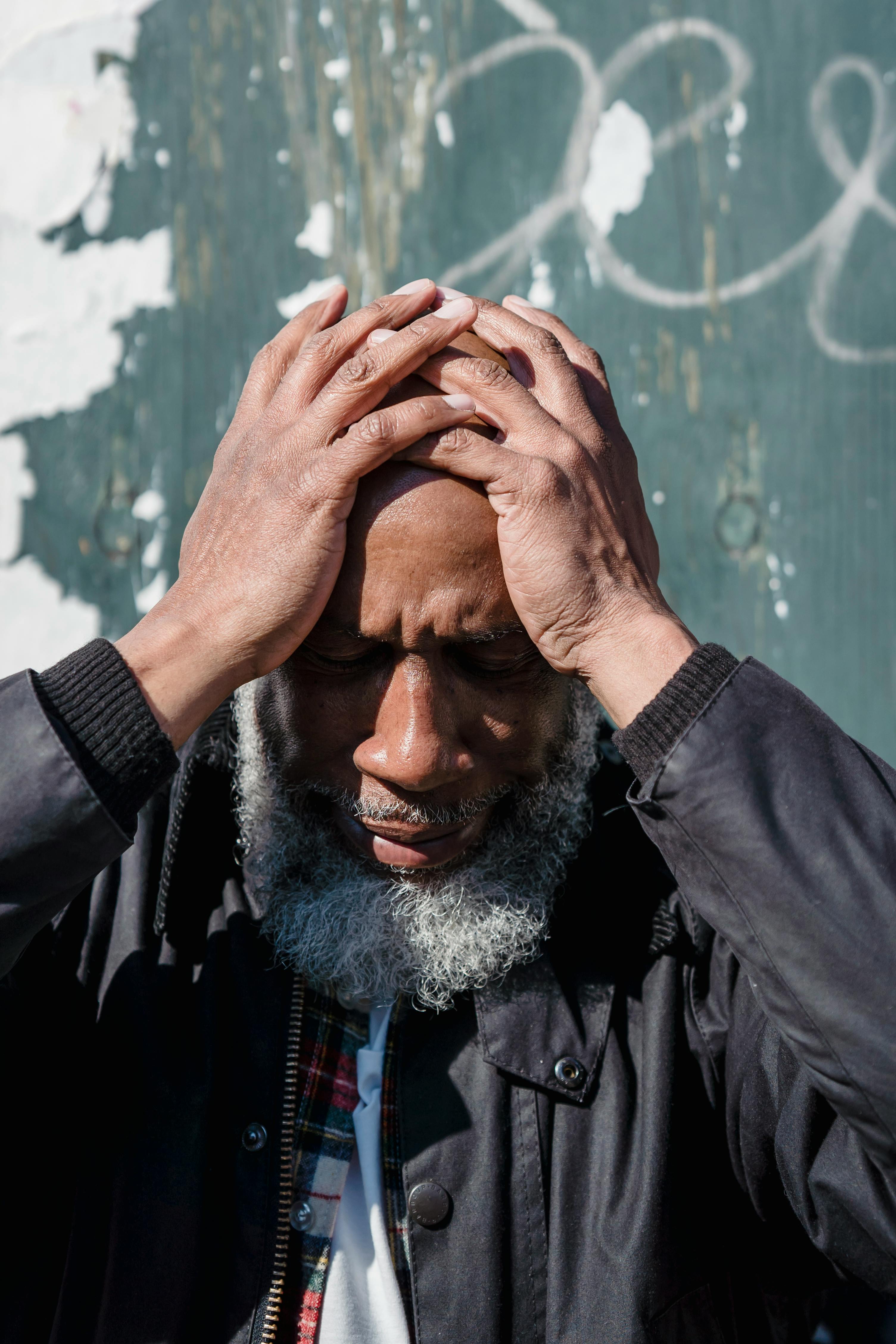 A Man with his Head in his Hands · Free Stock Photo