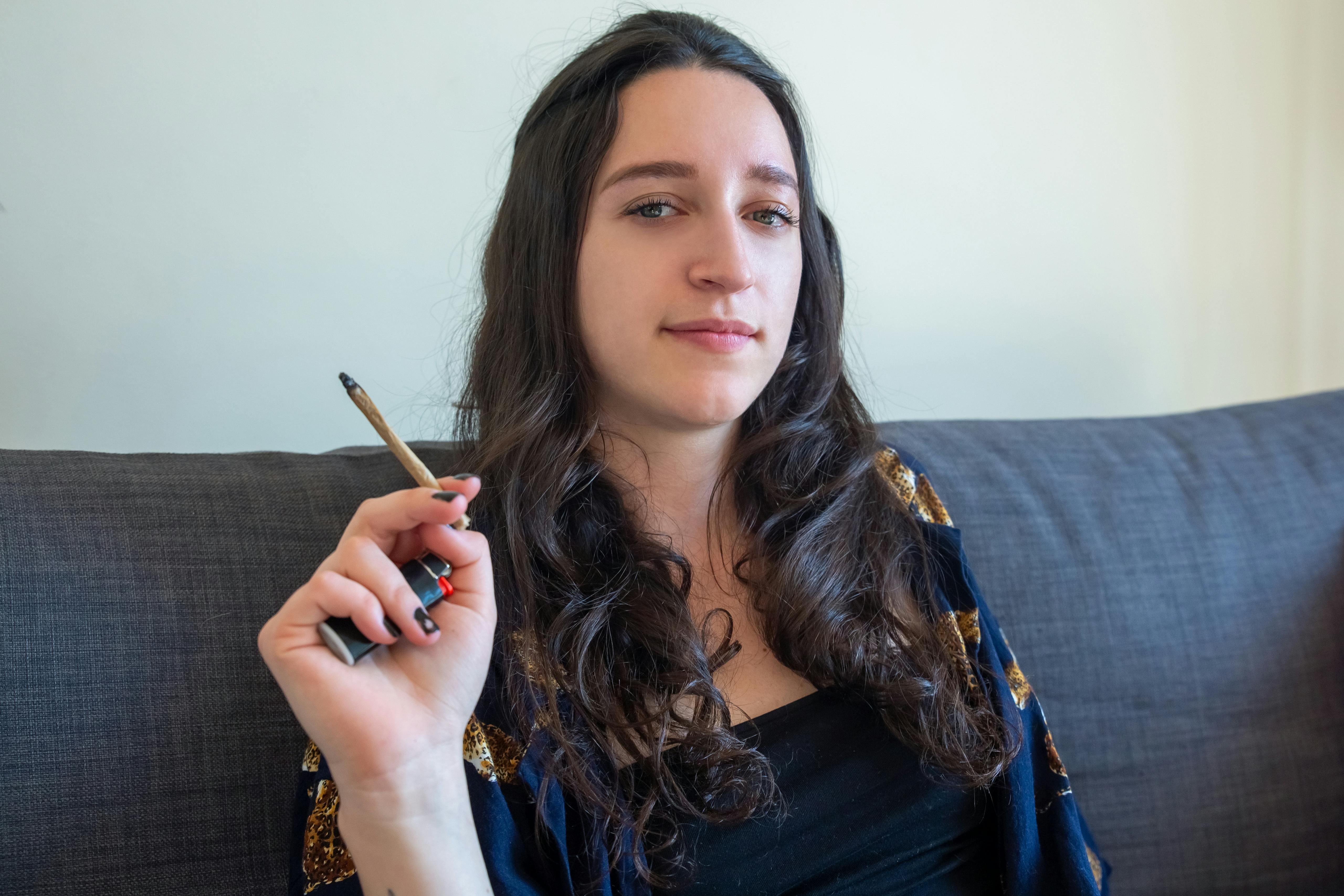A Woman Smoking a Joint · Free Stock Photo