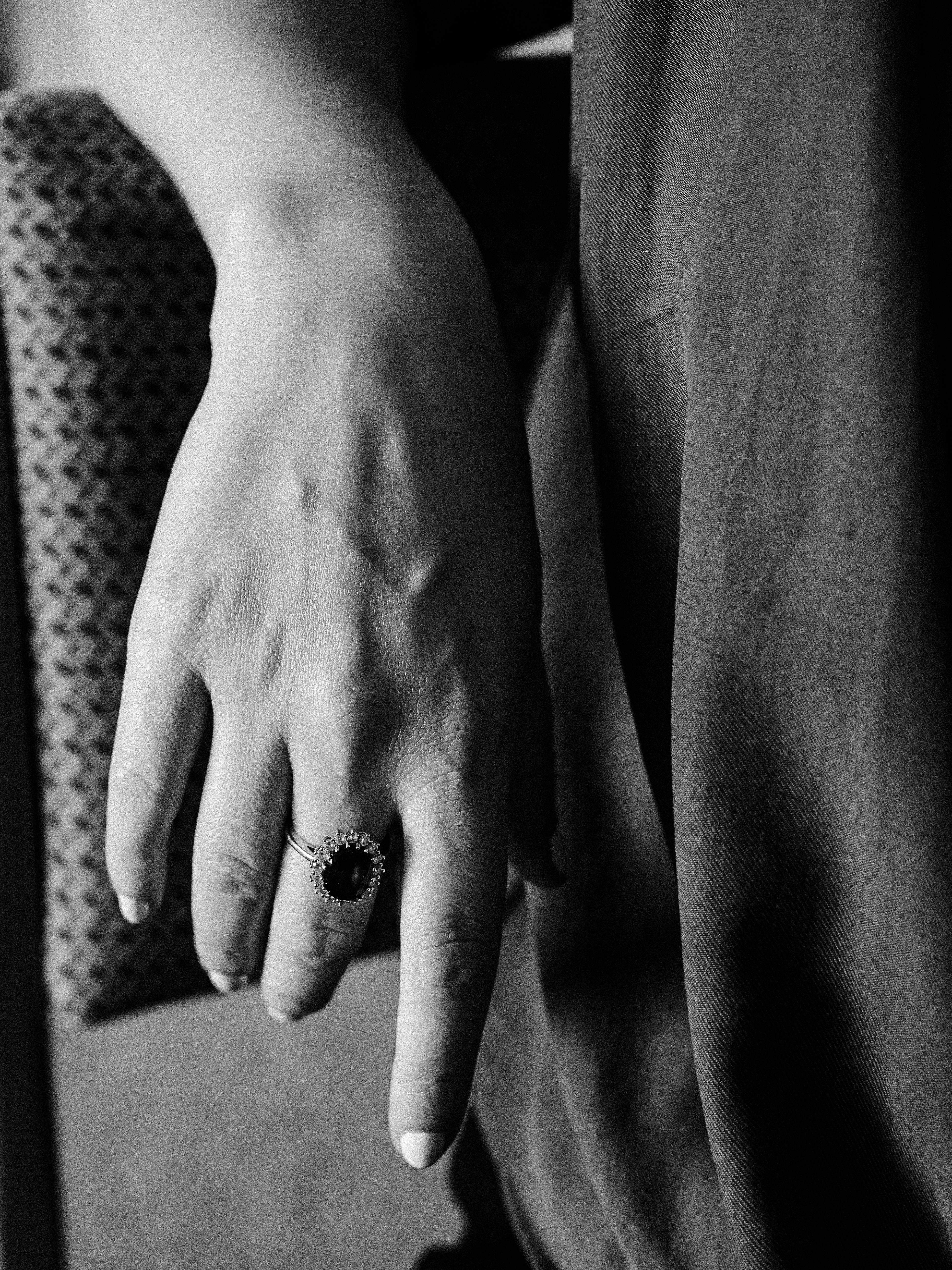 A Grayscale of a Hand with a Ring · Free Stock Photo