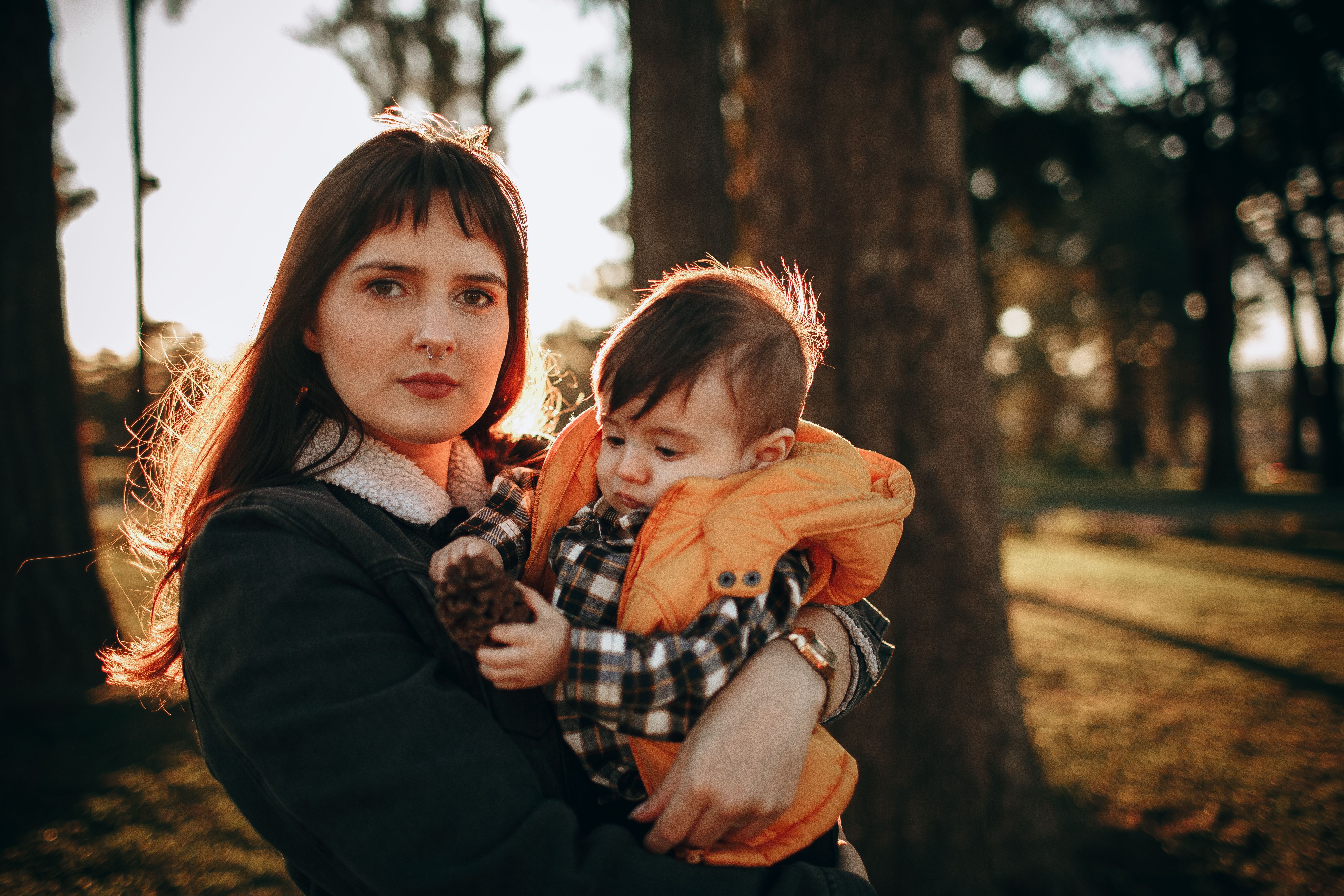 Cute children cuddling in armchair at home · Free Stock Photo