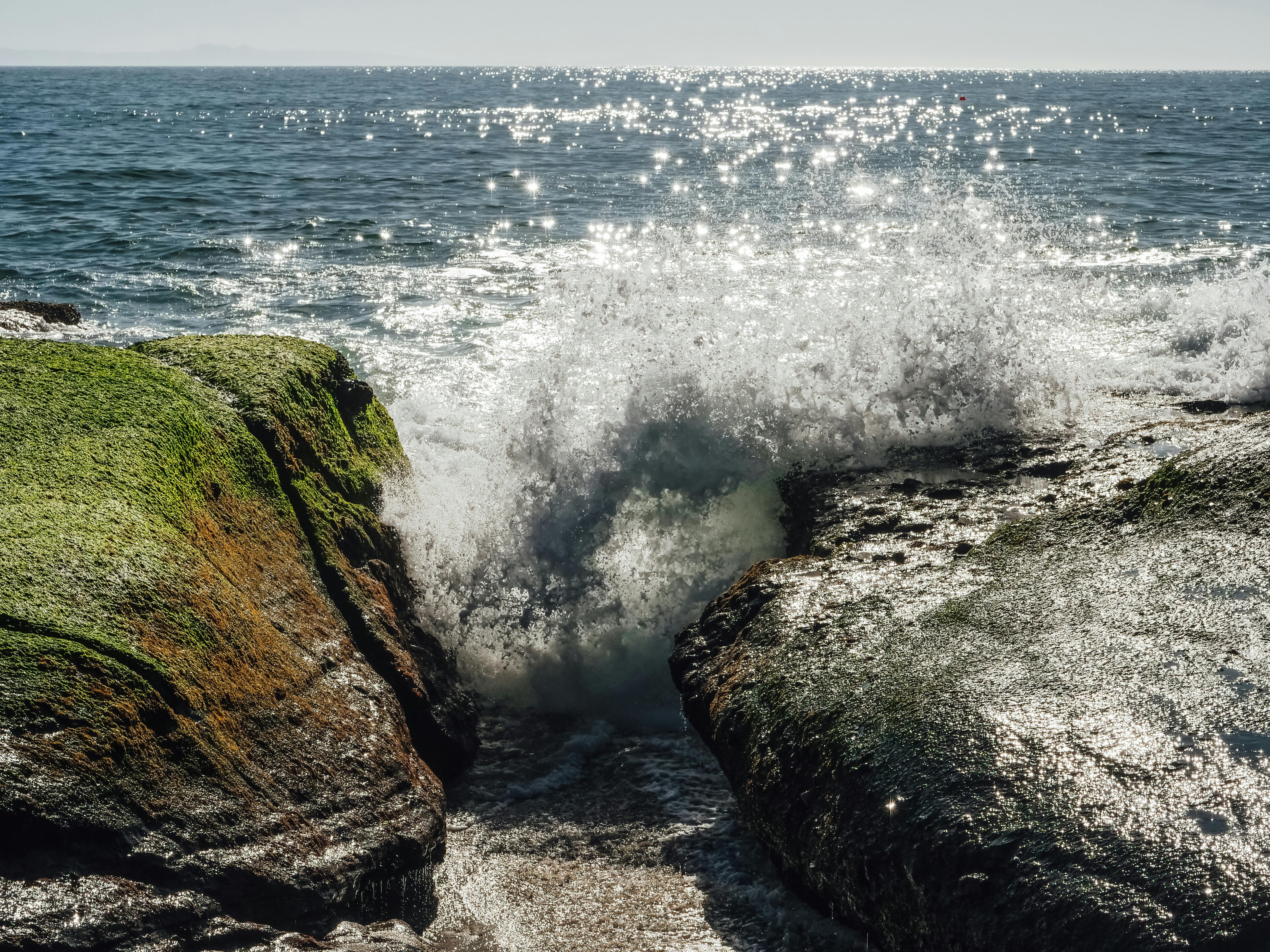 Water Waves Hitting Brown Rocks · Free Stock Photo