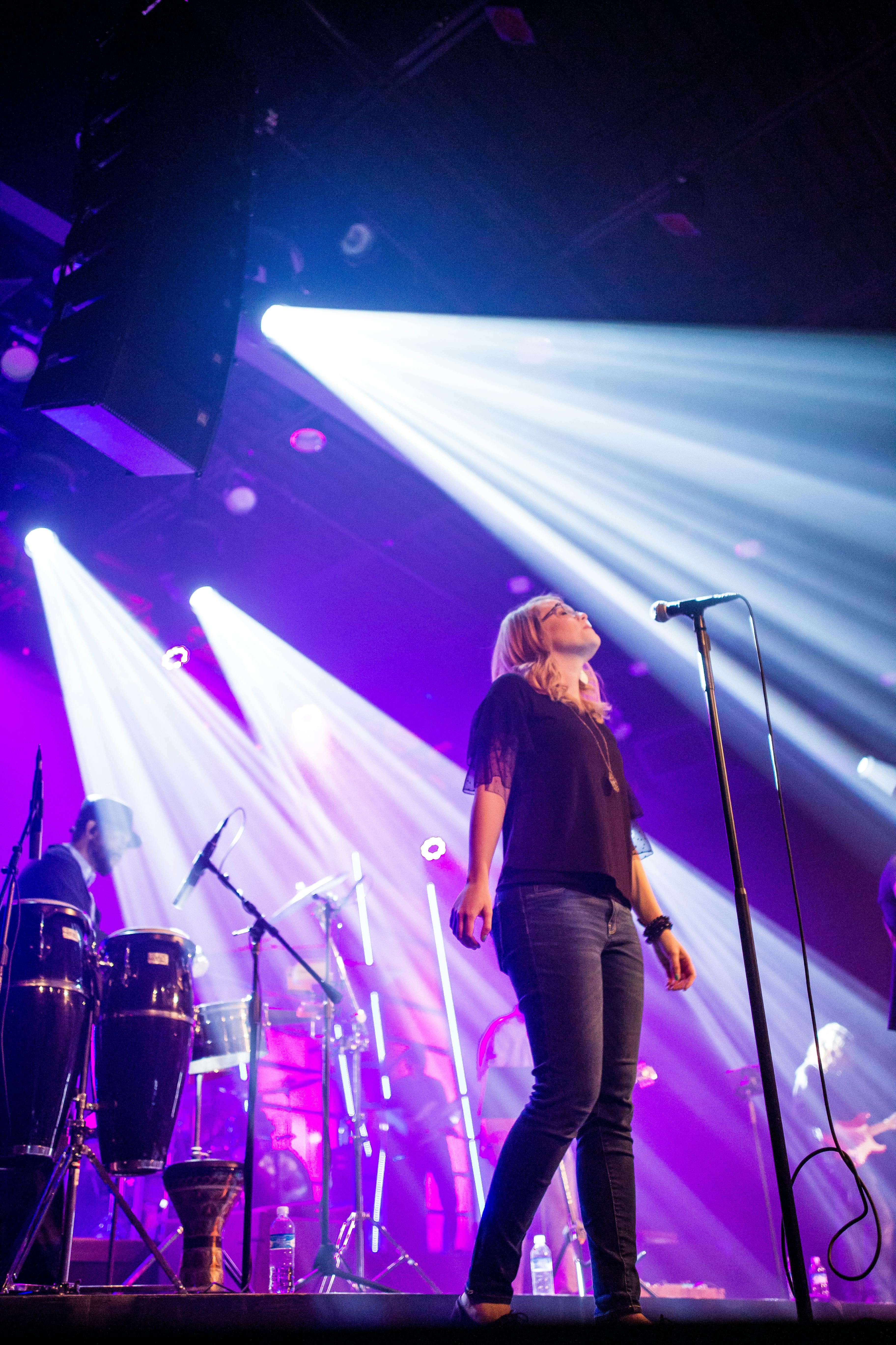 A Woman Singing on the Stage · Free Stock Photo