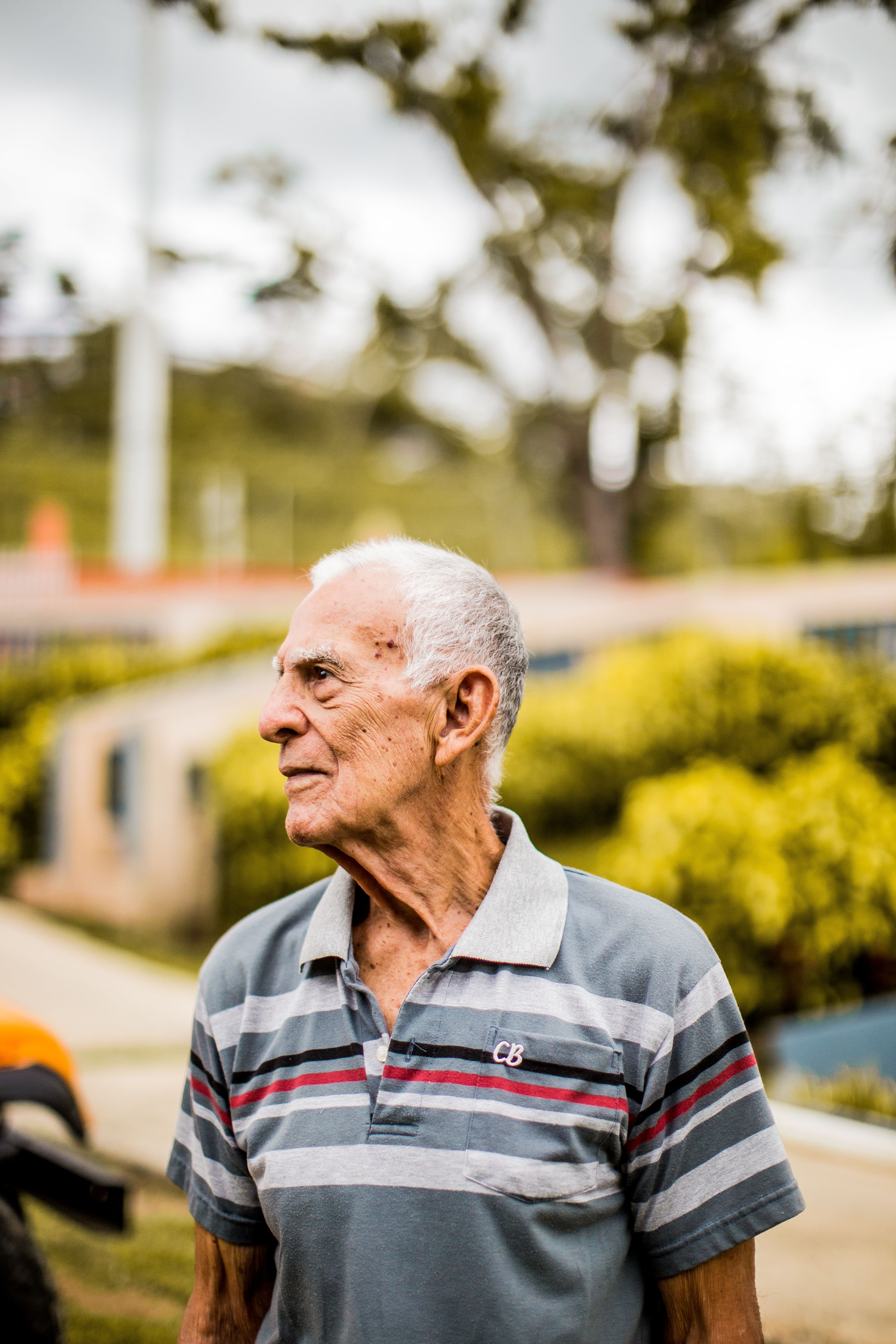 Old Man Standing Outdoors in Nature · Free Stock Photo