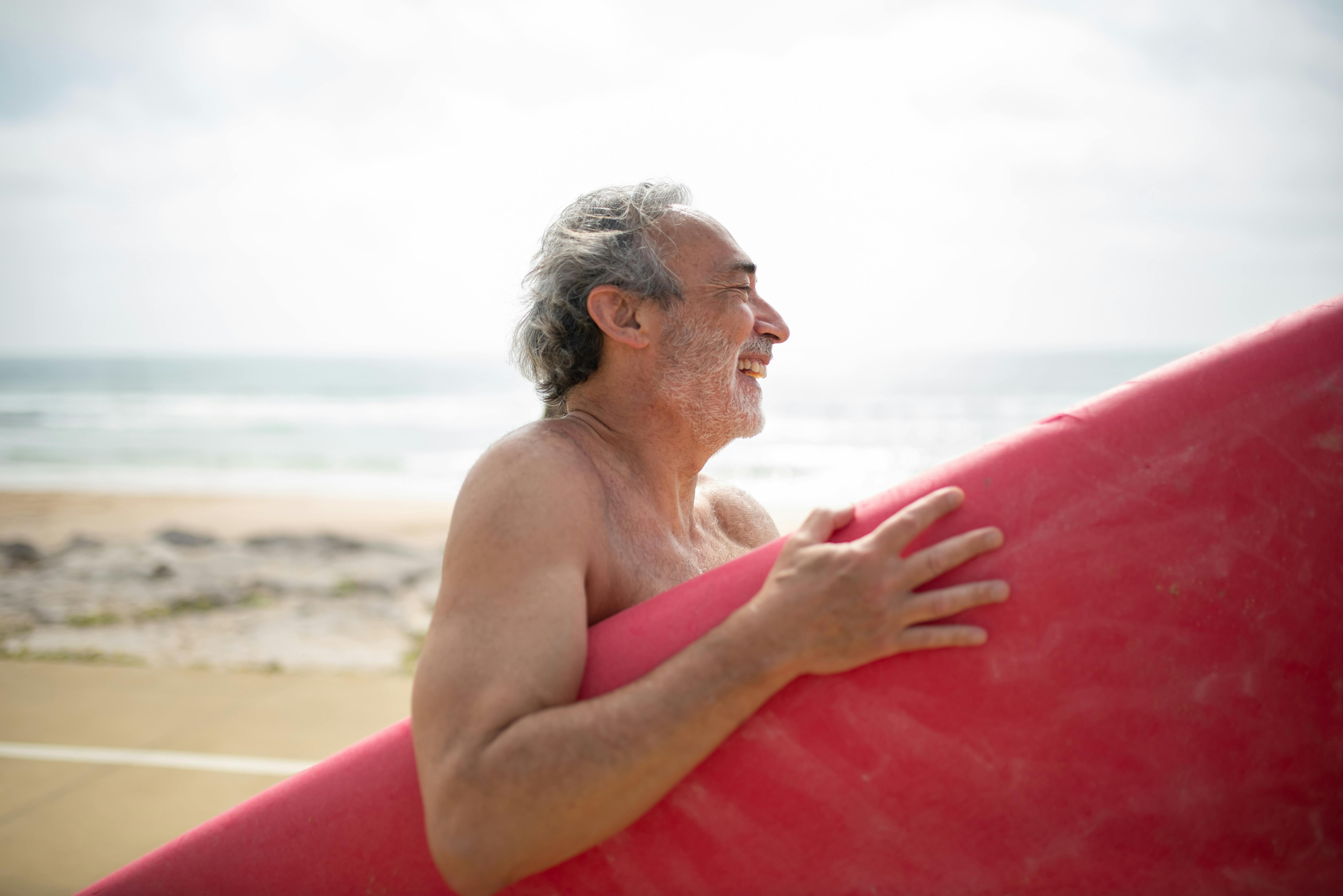 A Man Falling Off a Surfboard · Free Stock Photo