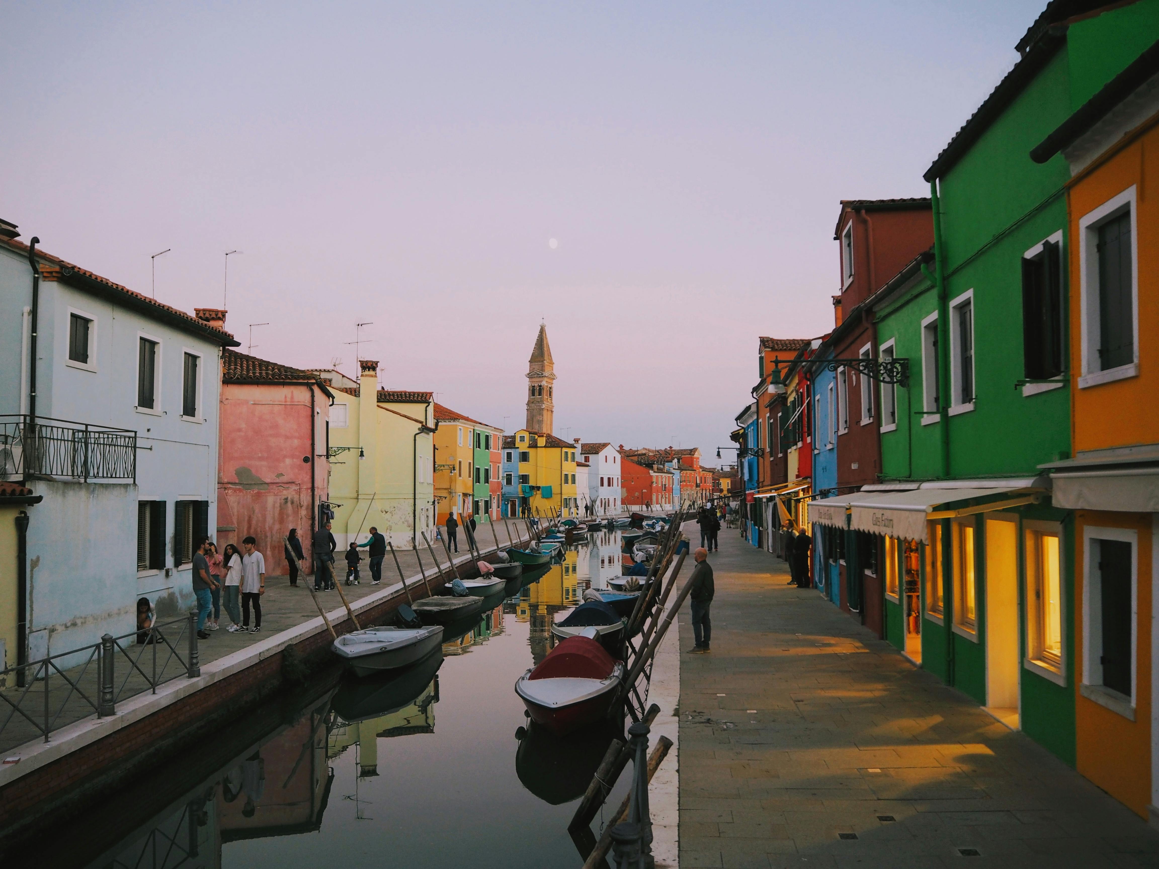 Colorful Concrete Buildings Near Water Canal · Free Stock Photo