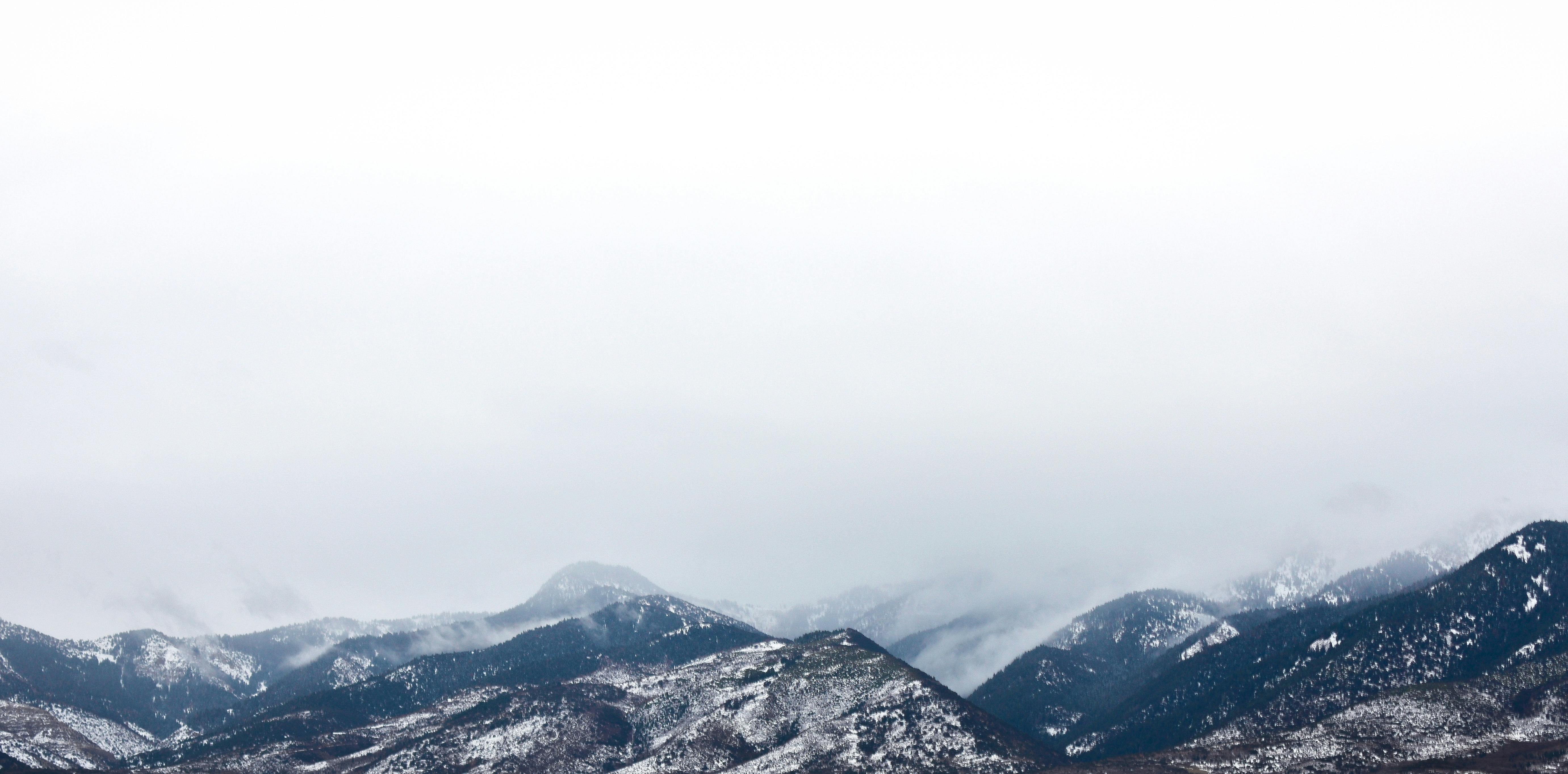 Snow Coated Mountain Under White Clouds · Free Stock Photo