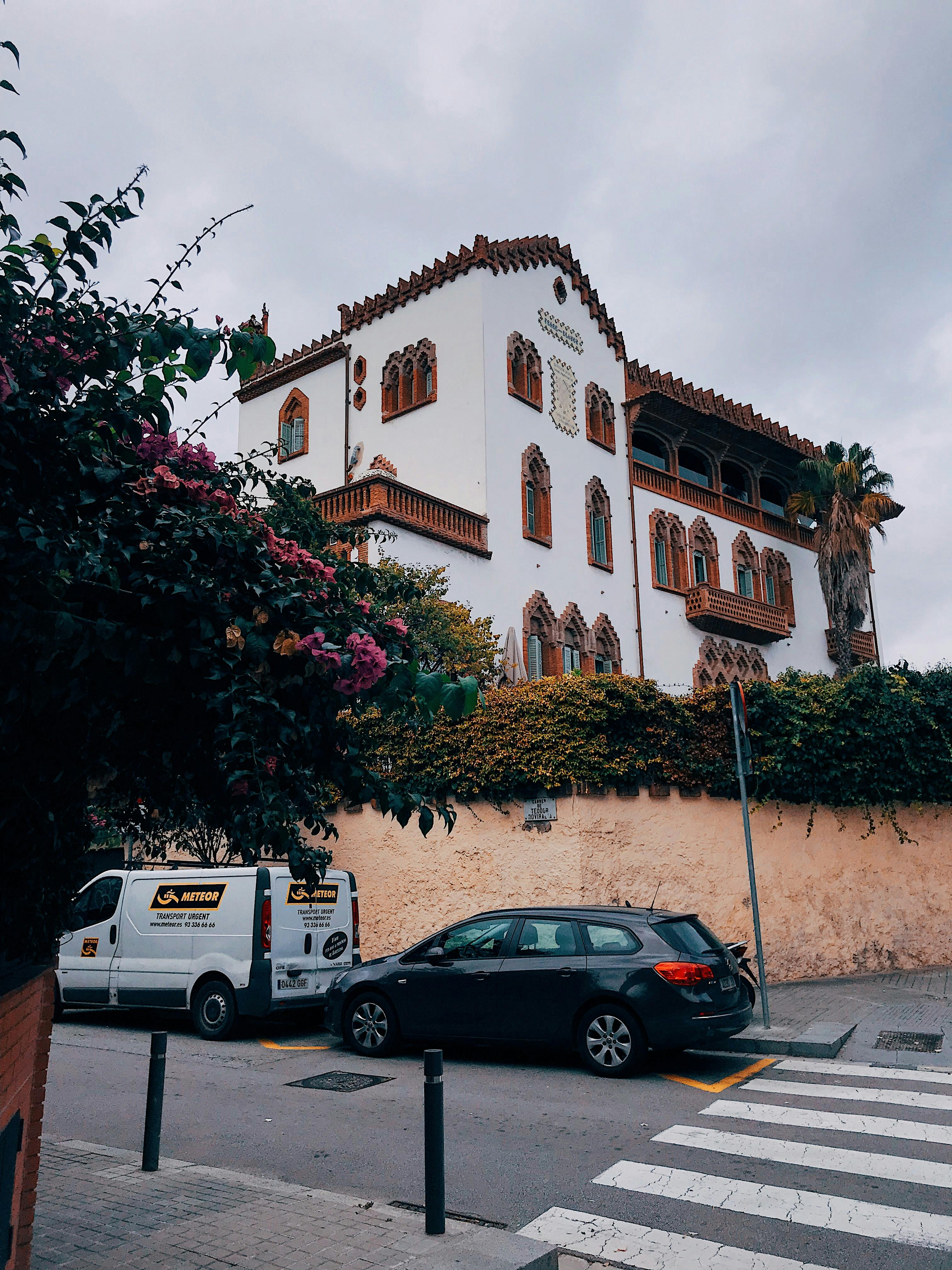 Cars on Road Near Concrete Building · Free Stock Photo