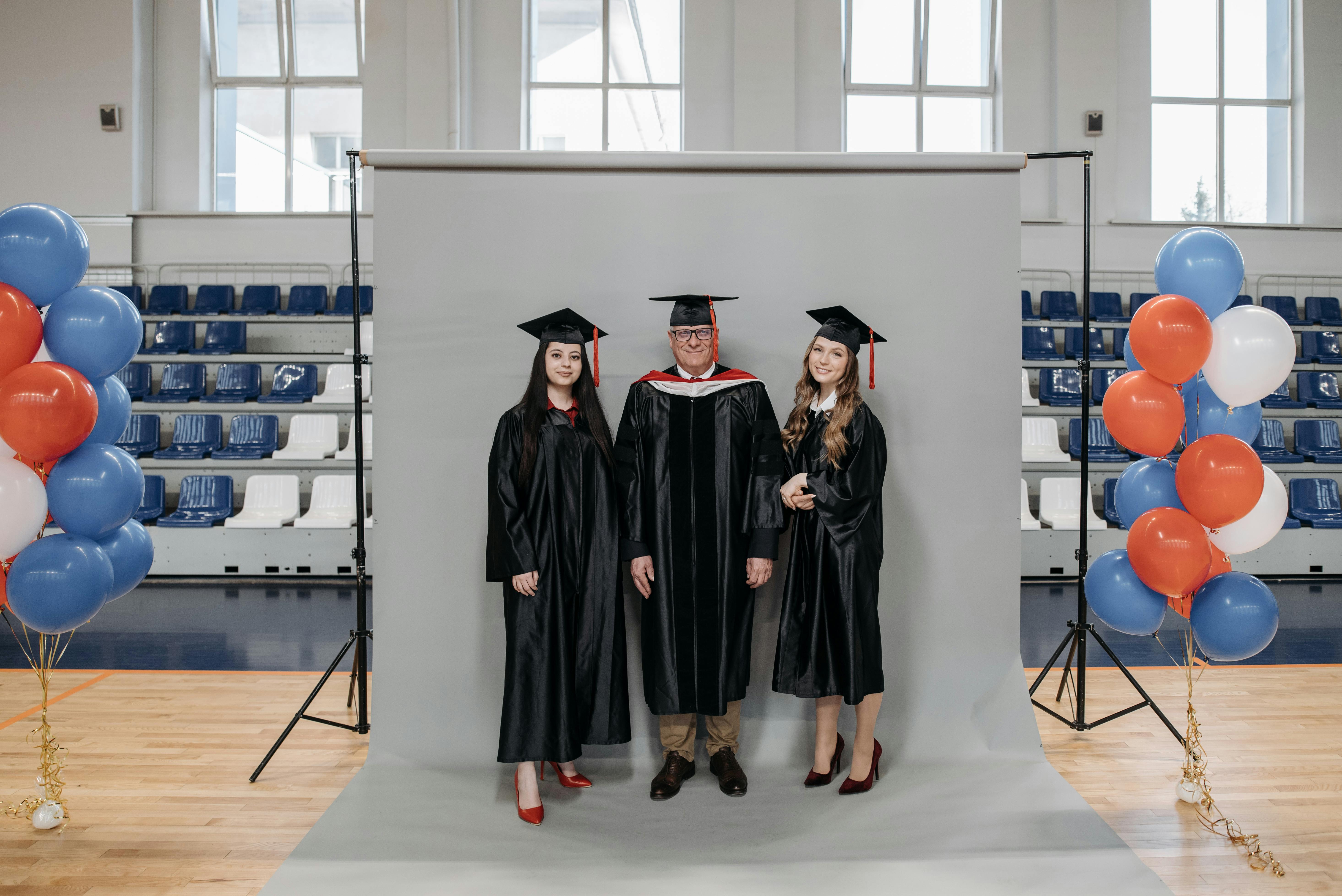 Photo of People Taking a Graduation Picture · Free Stock Photo