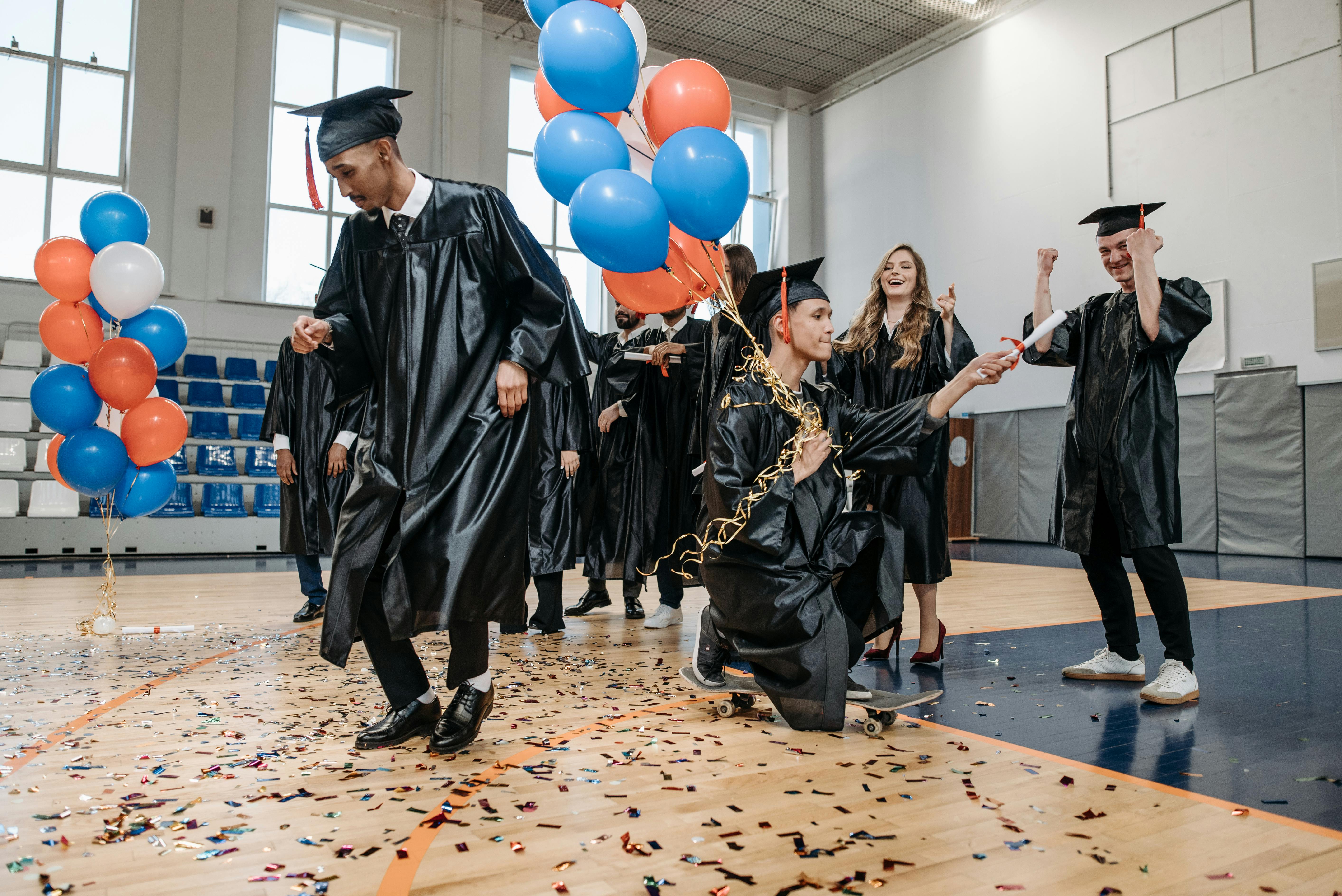 Photo of Fresh Graduates Celebrating in Gym · Free Stock Photo