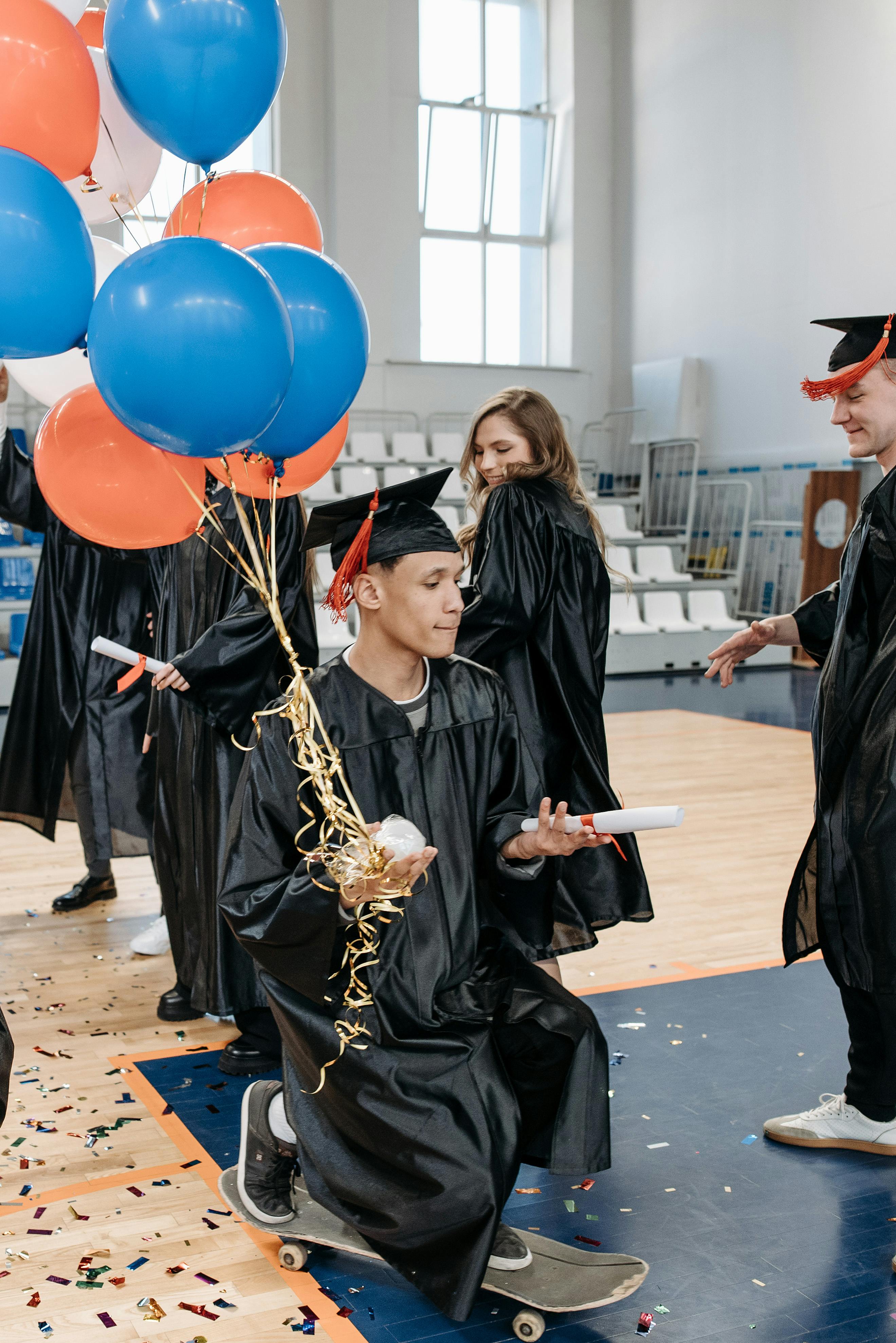 Photo of Fresh Graduates Celebrating in Gym · Free Stock Photo