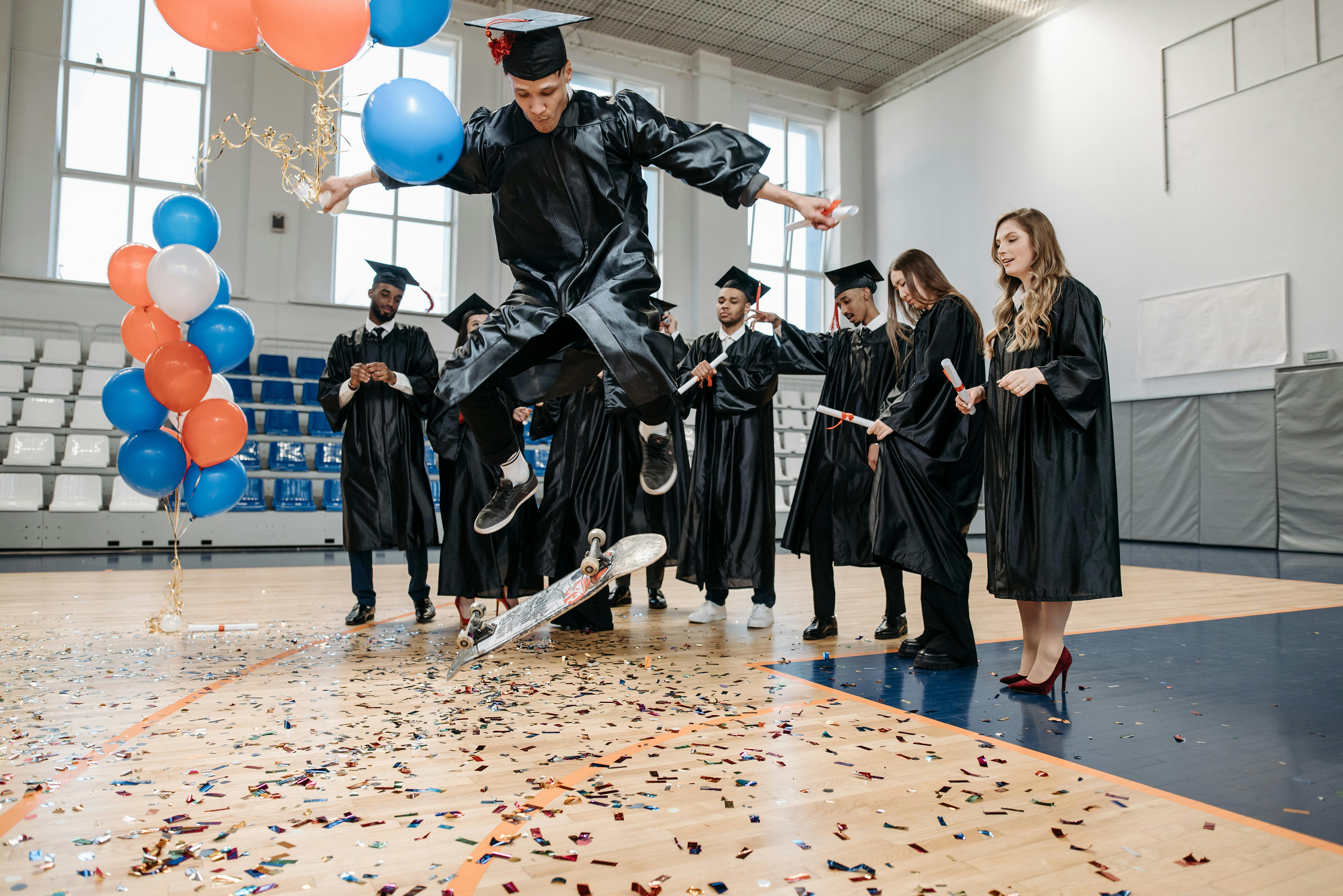 Photo of Fresh Graduate Student Doing Skateboarding Tricks · Free Stock ...