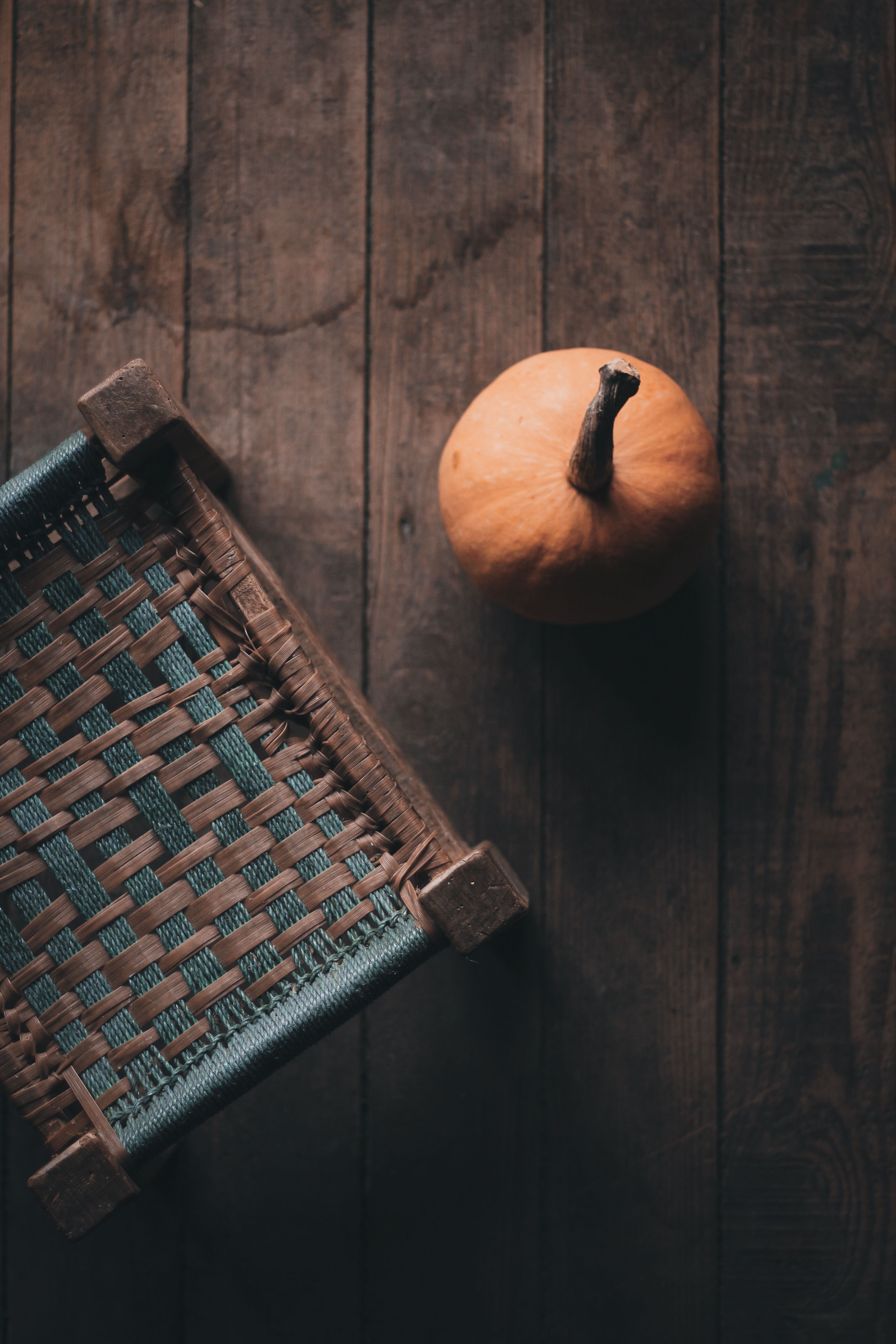 Fresh pumpkin placed on wooden floor in room · Free Stock Photo