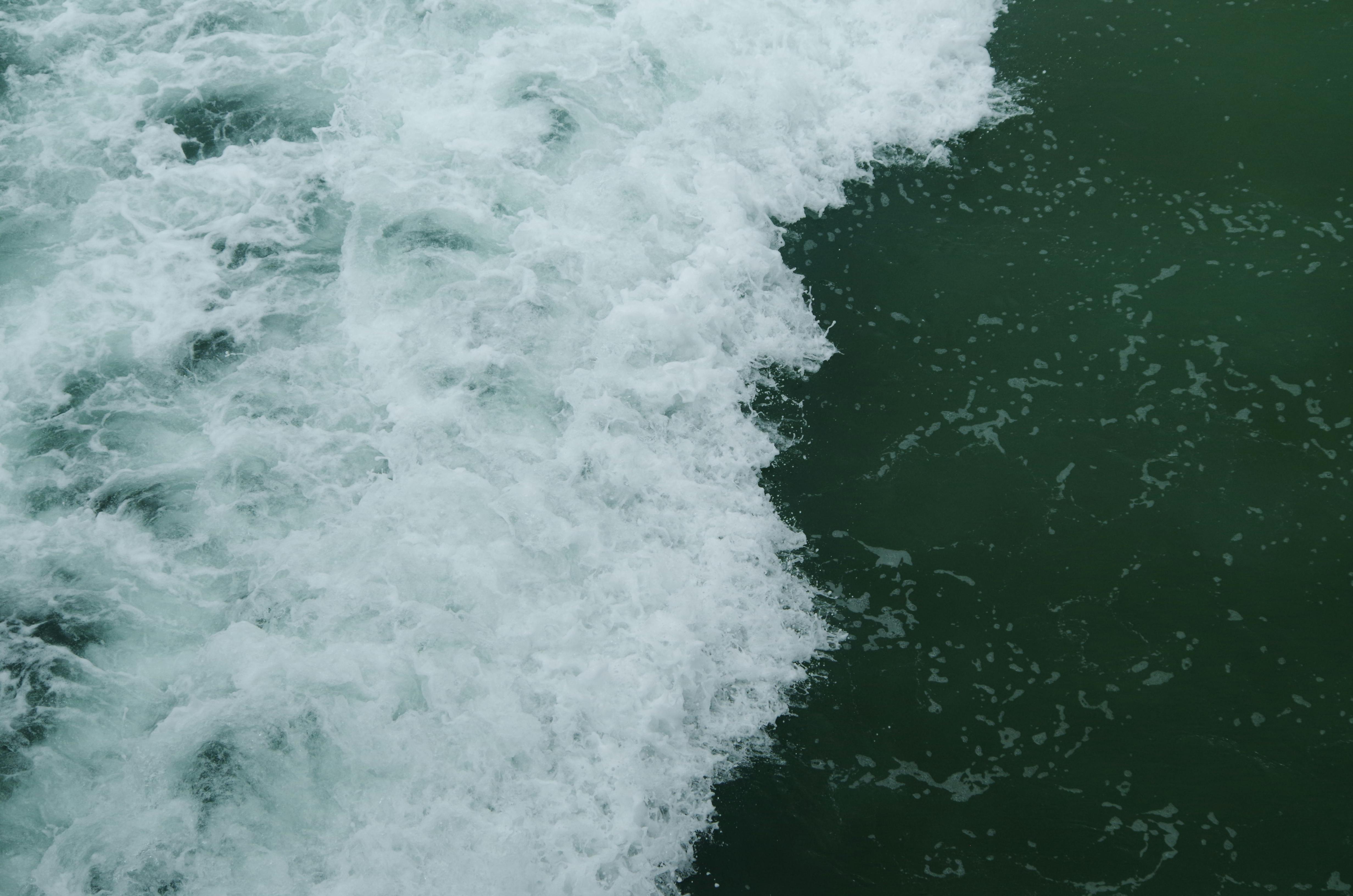 Sea Water forming Seafoams · Free Stock Photo