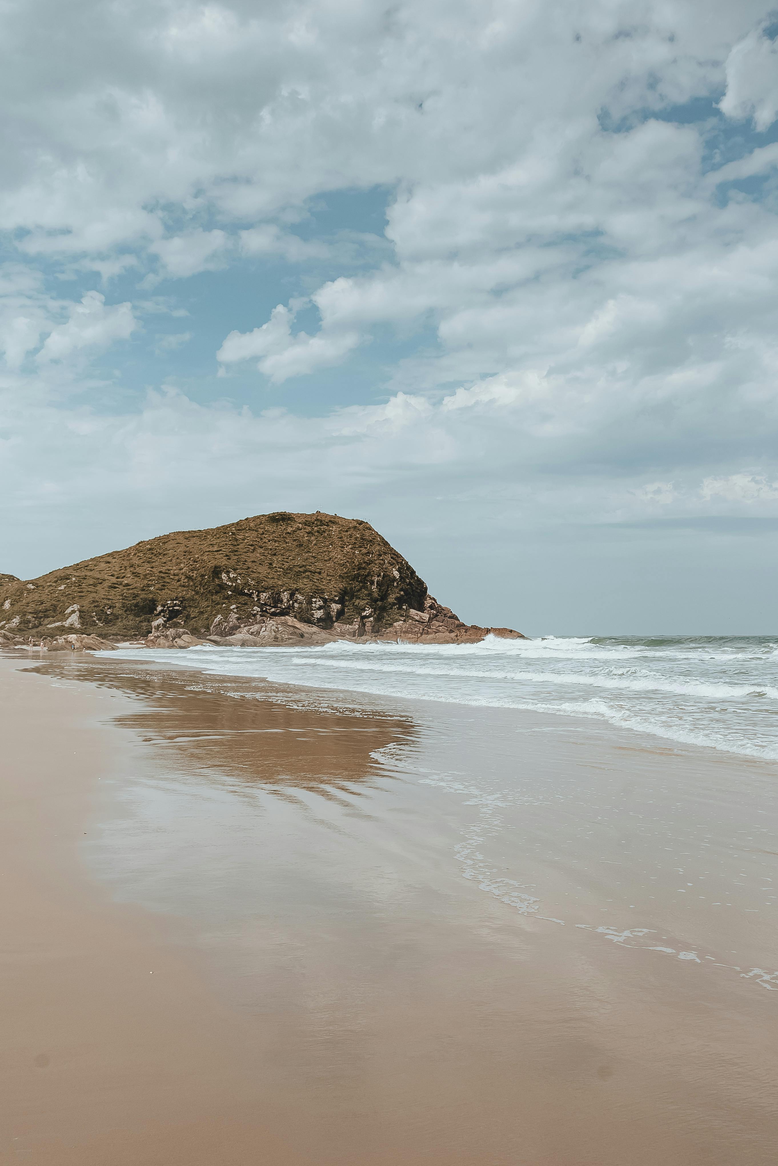 Rocks Forming Arch on Beach · Free Stock Photo