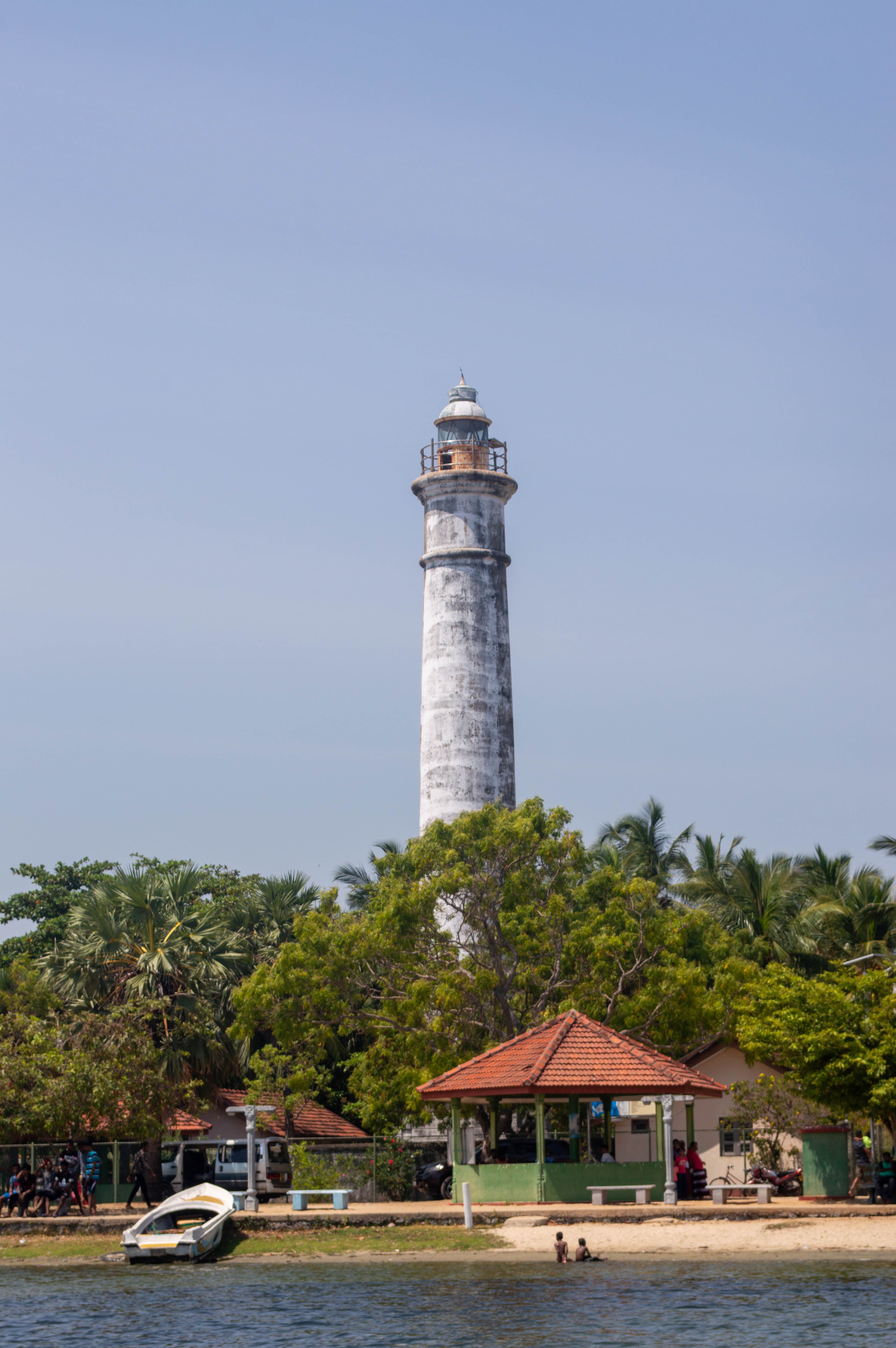 White Lighthouse Tower Under Blue Sky · Free Stock Photo