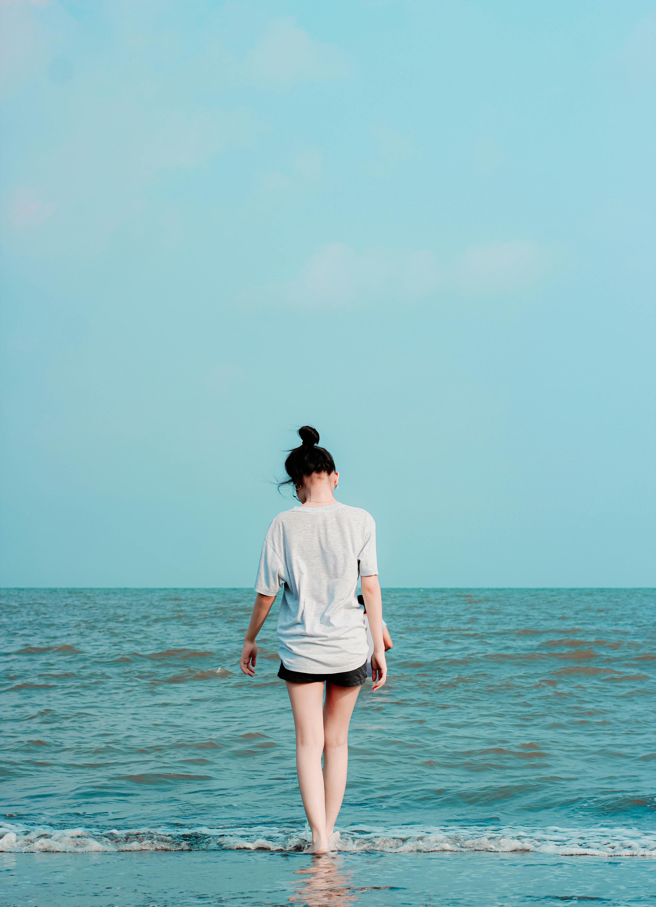 Back View of a Woman at the Beach · Free Stock Photo