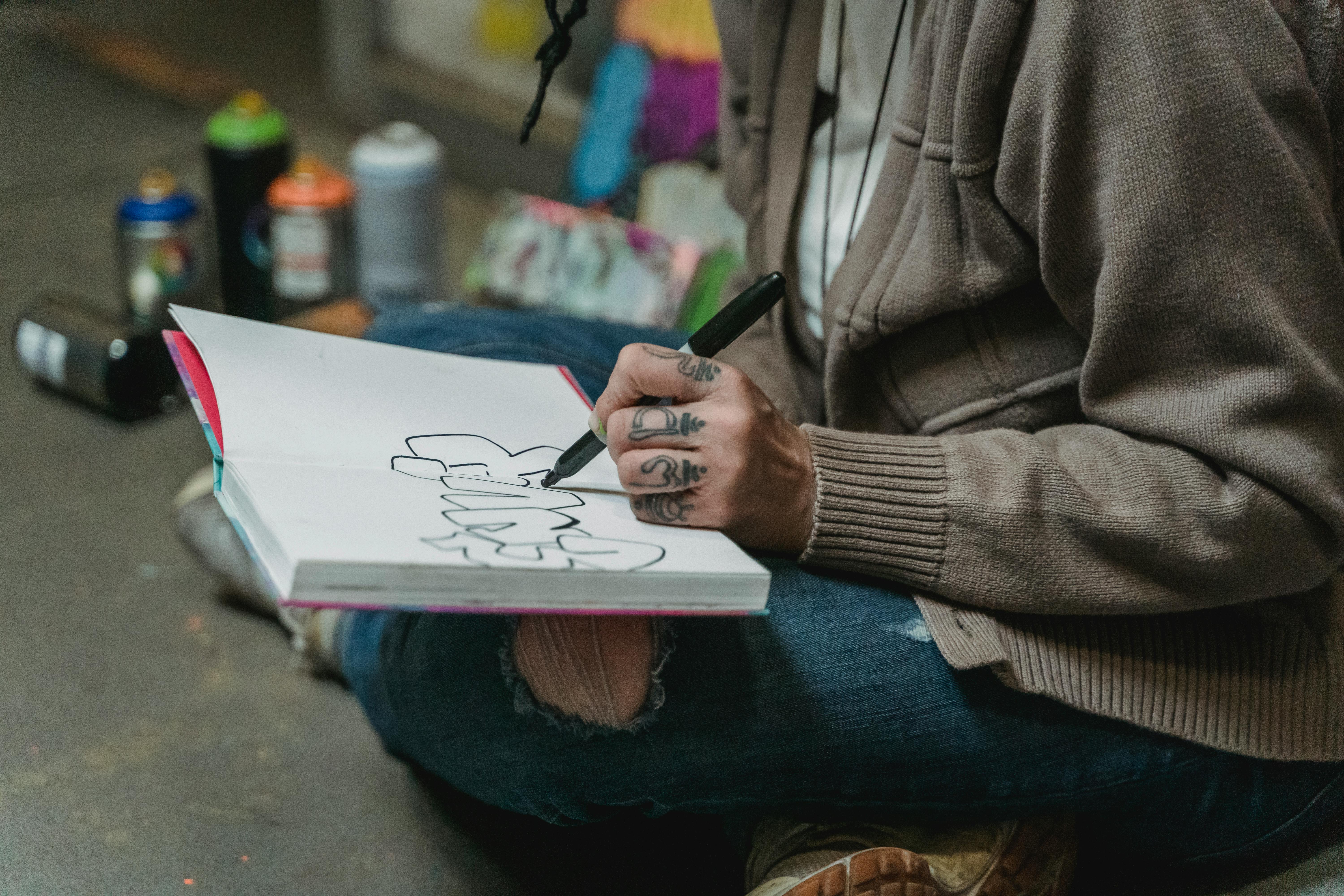 Person Writing Illustration in Spiral Notebook · Free Stock Photo