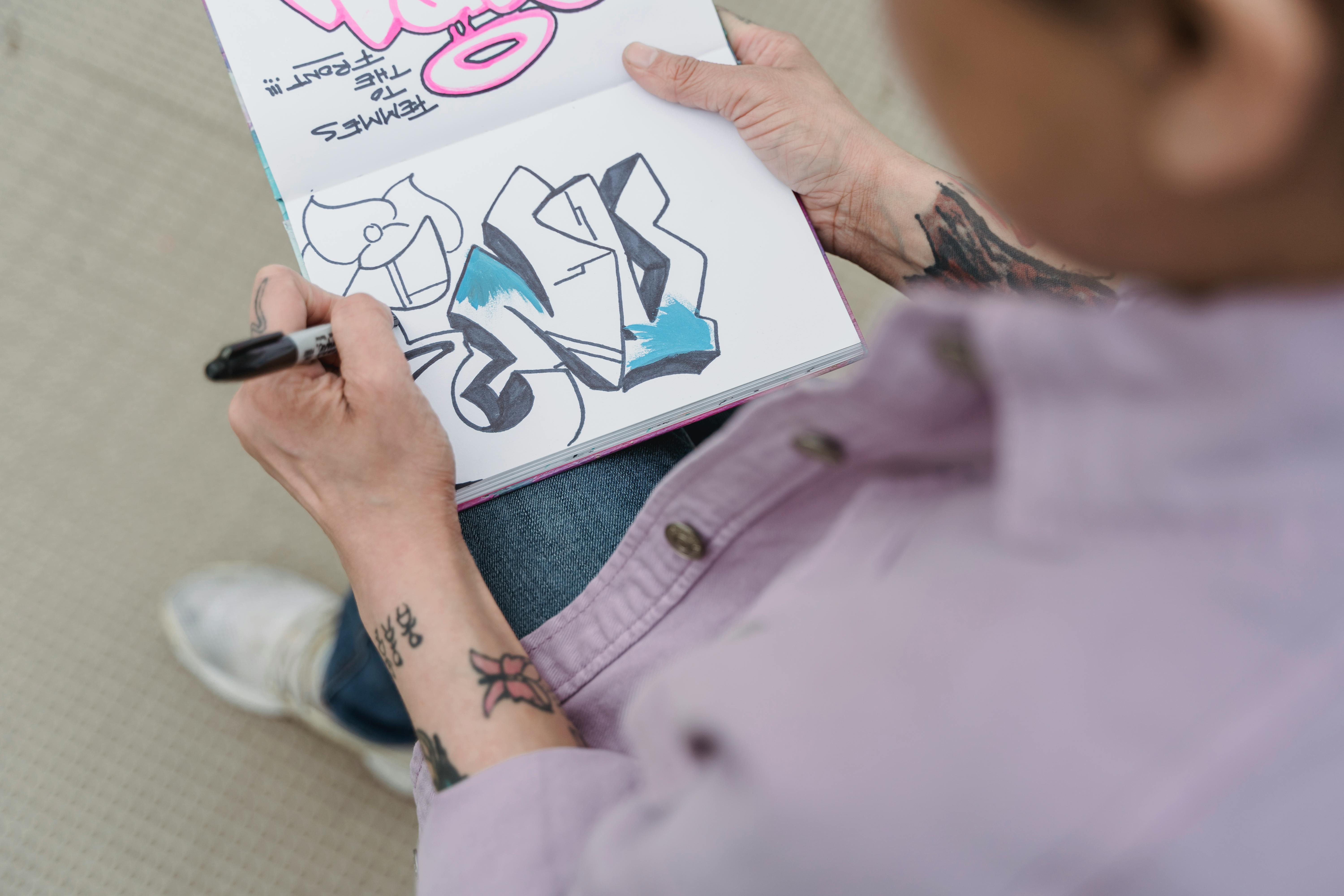 Drawing in Notebook · Free Stock Photo