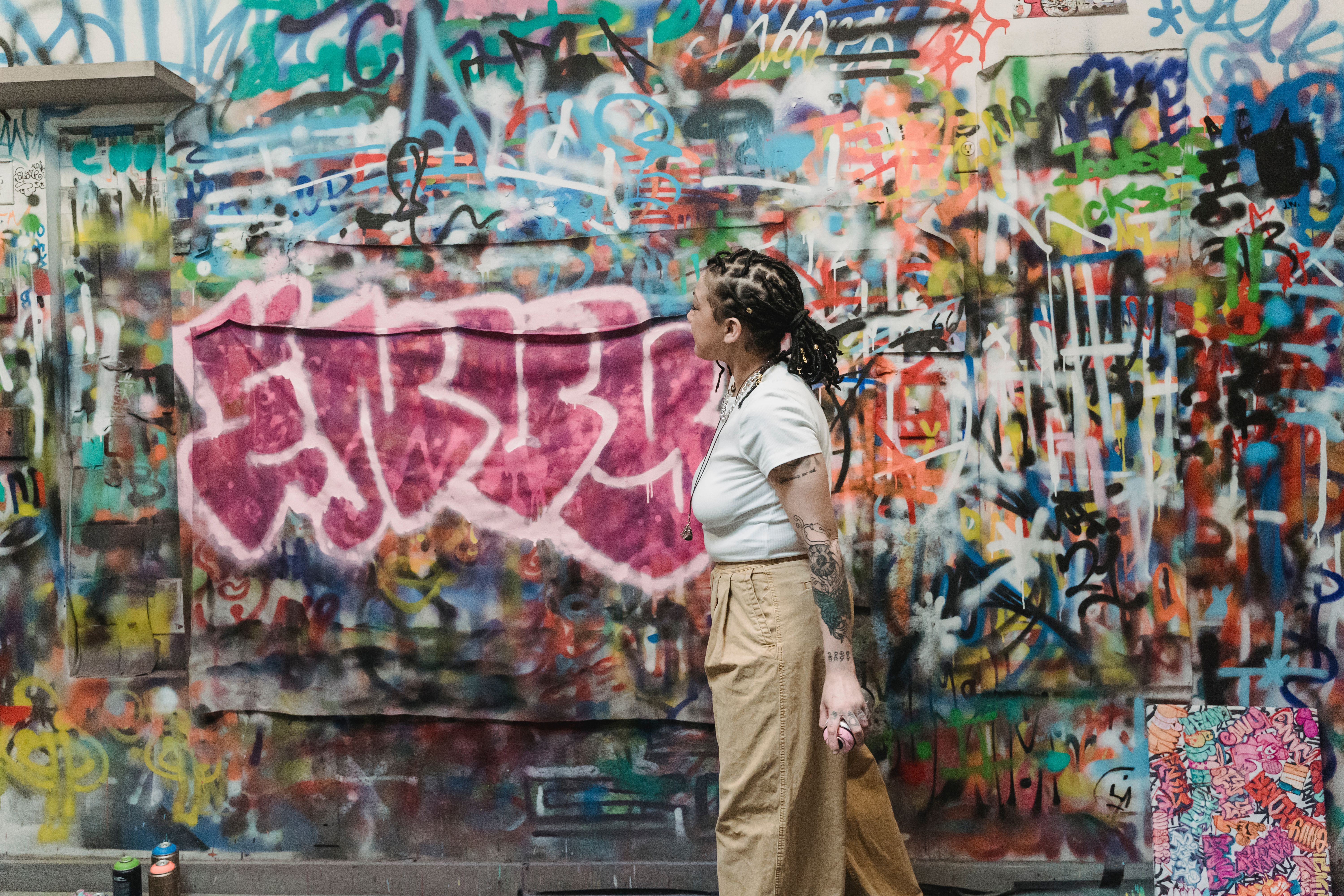 A Woman Spray Painting on the Wall · Free Stock Photo