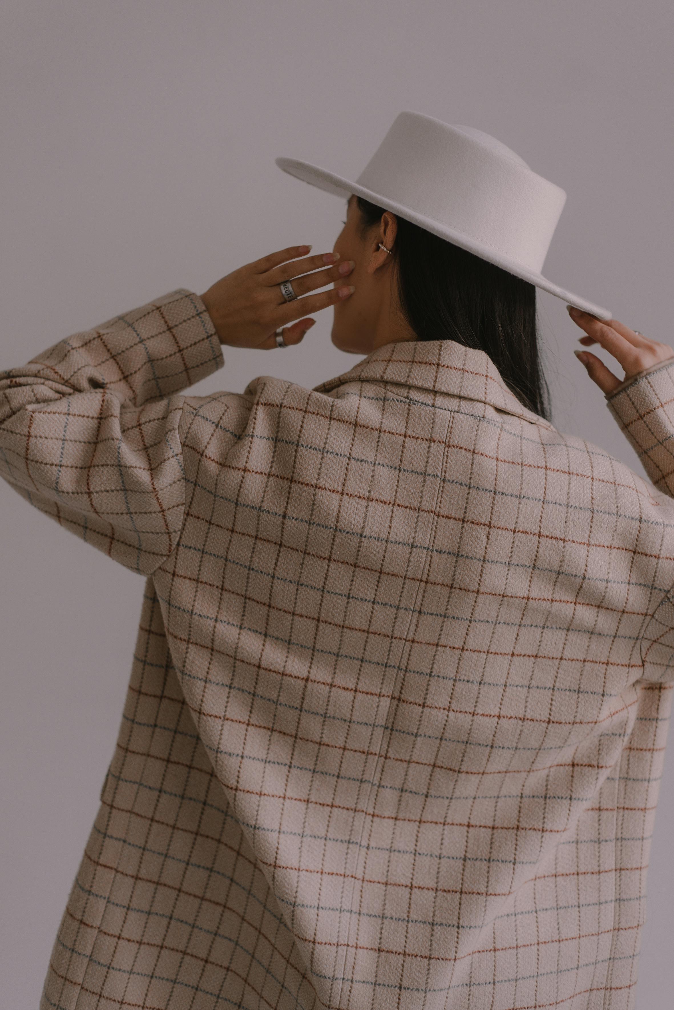 Back View of a Woman with a White Hat · Free Stock Photo