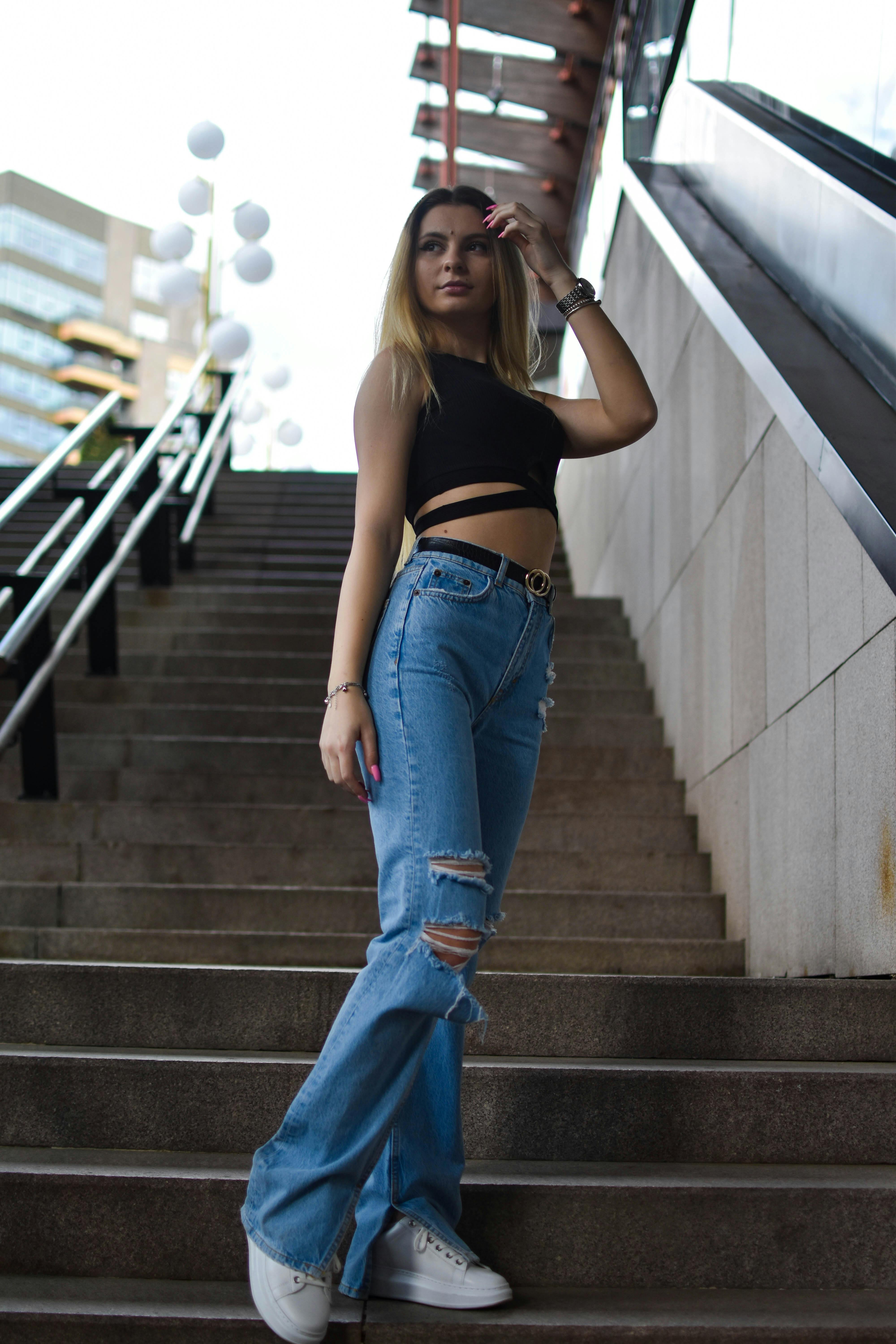 Portrait of a Woman Sitting on Steps · Free Stock Photo