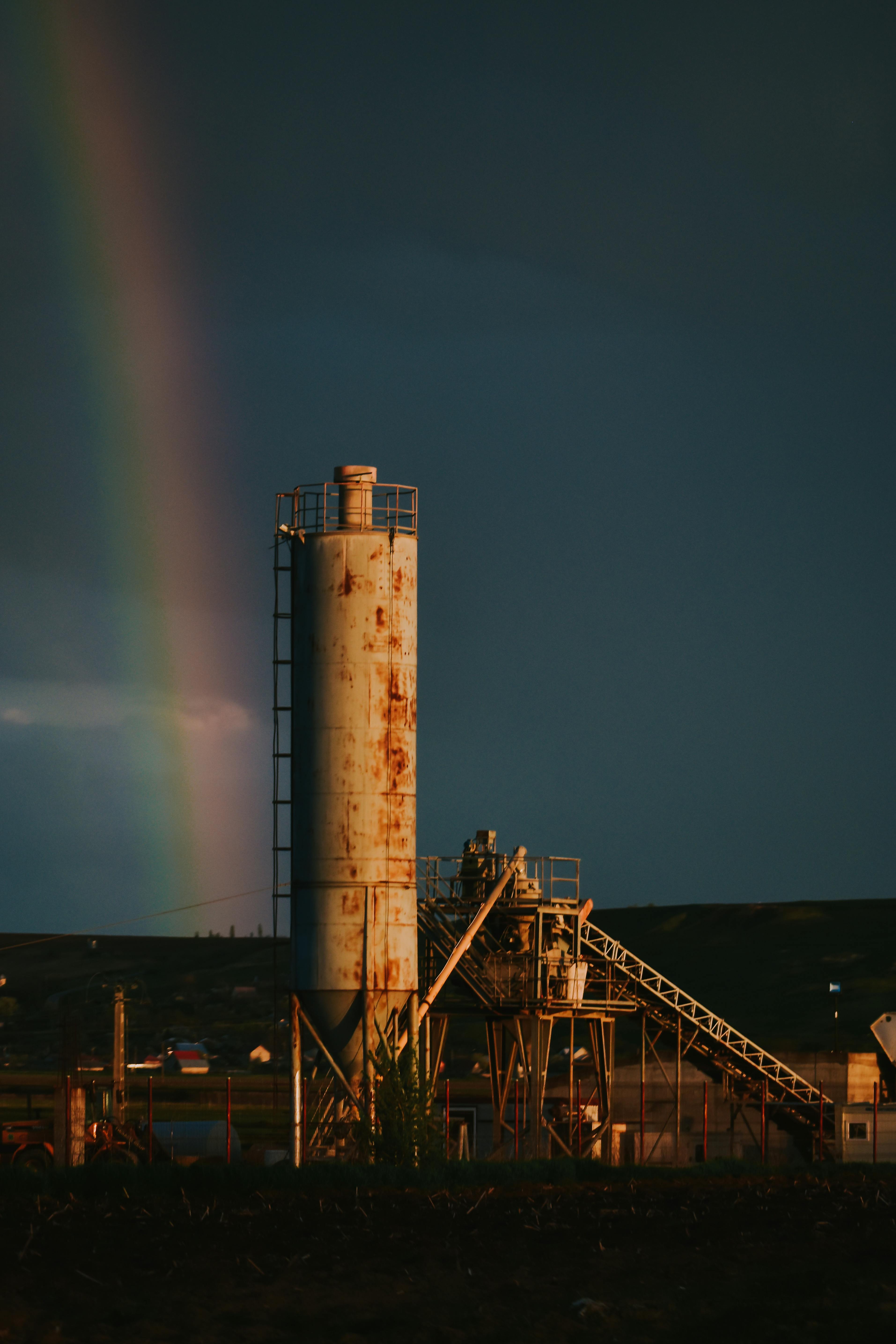 Rainbow Over a Rusty Factory · Free Stock Photo