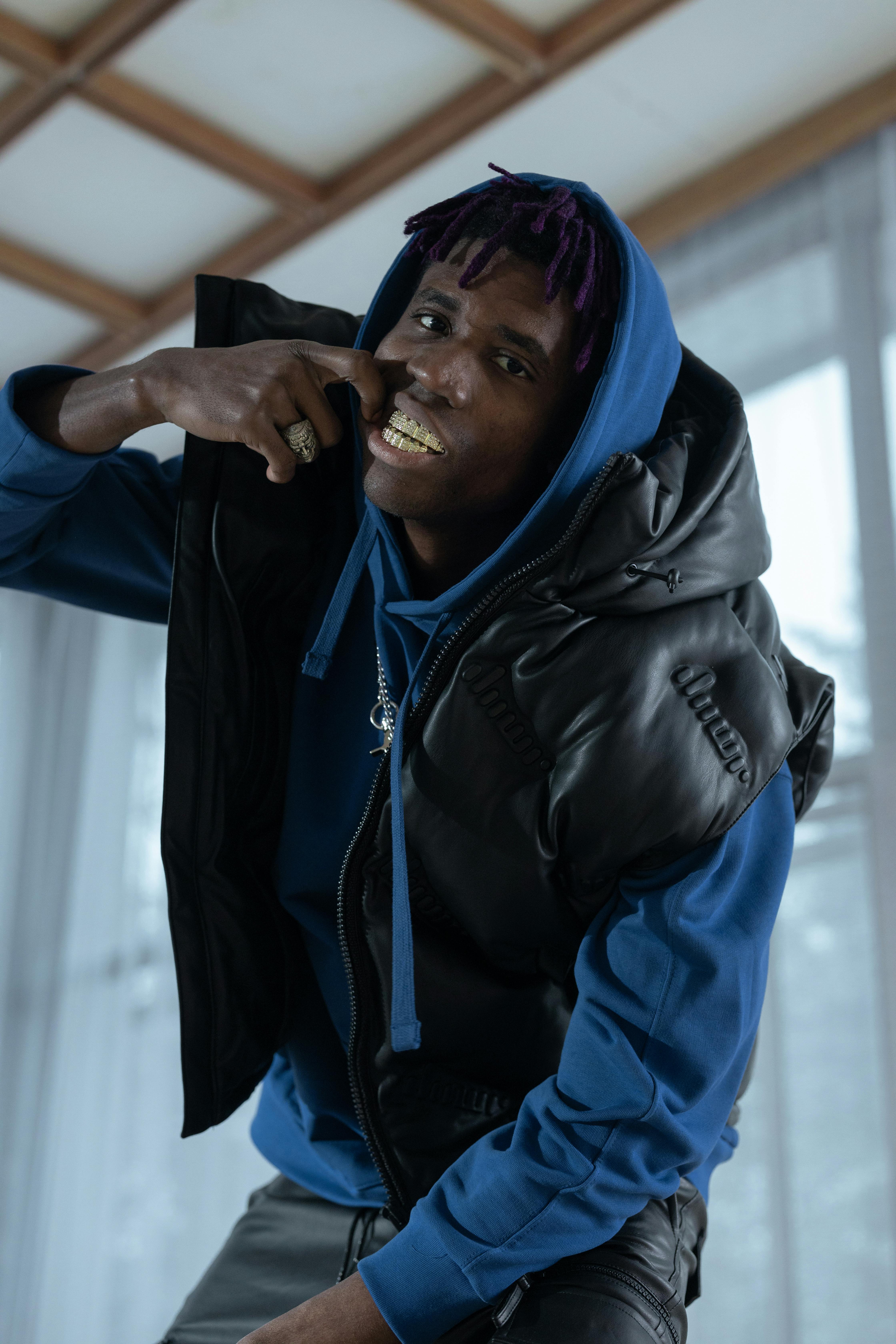 Man in a Blue Hoodie Posing · Free Stock Photo