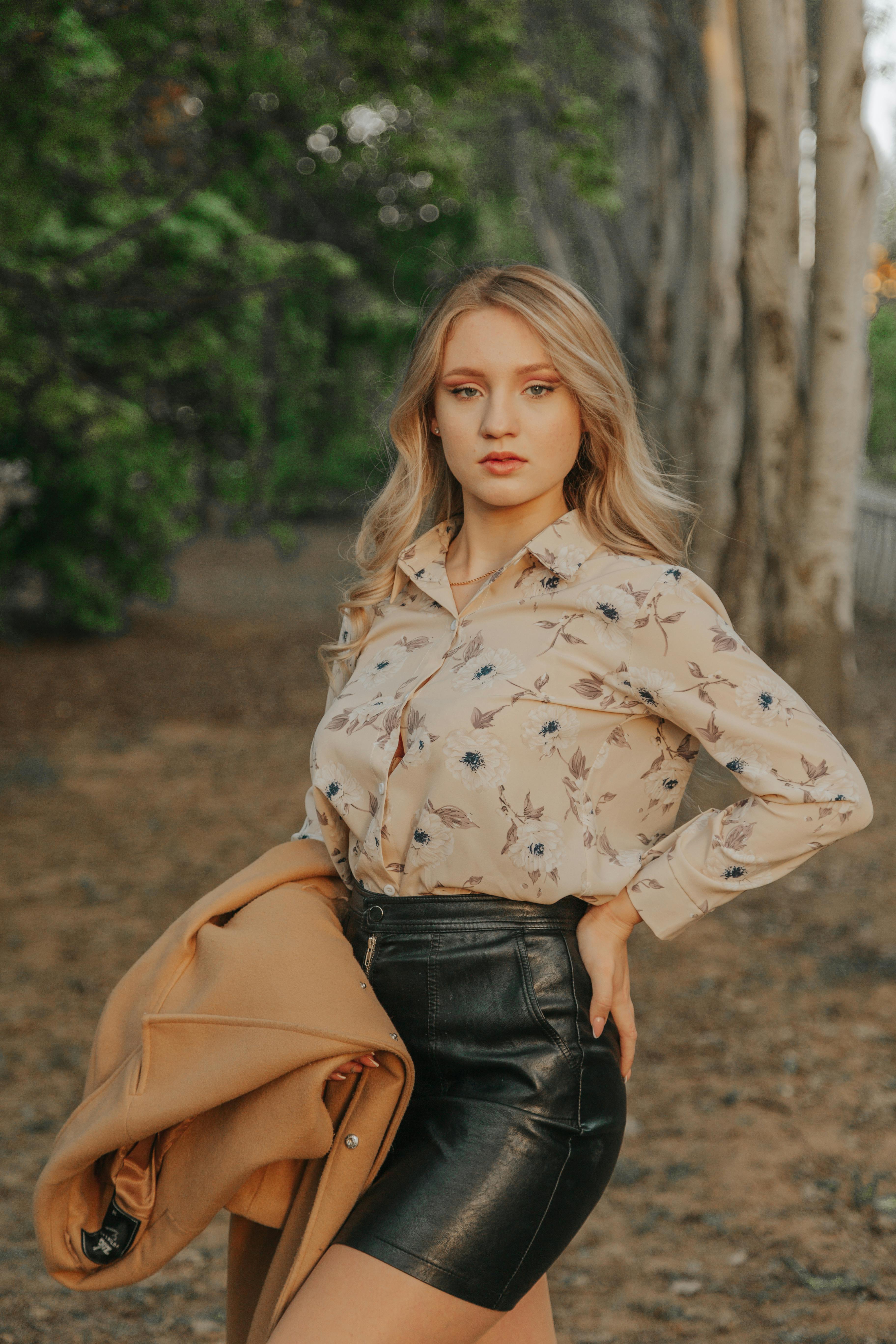 Trendy model with hand on hip in park · Free Stock Photo