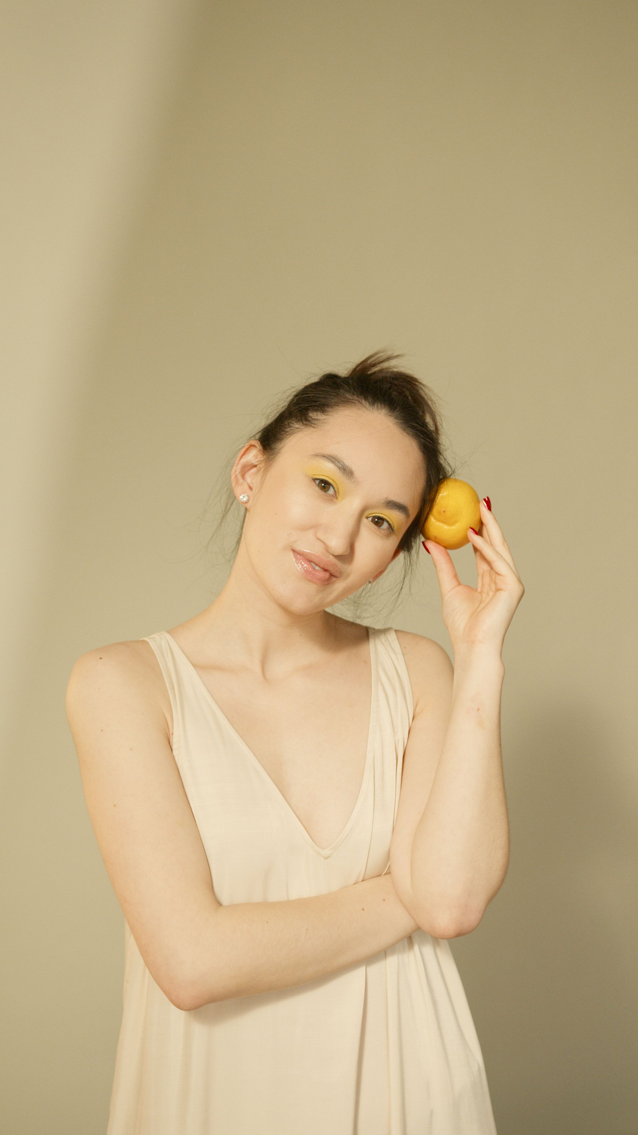 A Woman with Red Hair Holding a Lime · Free Stock Photo