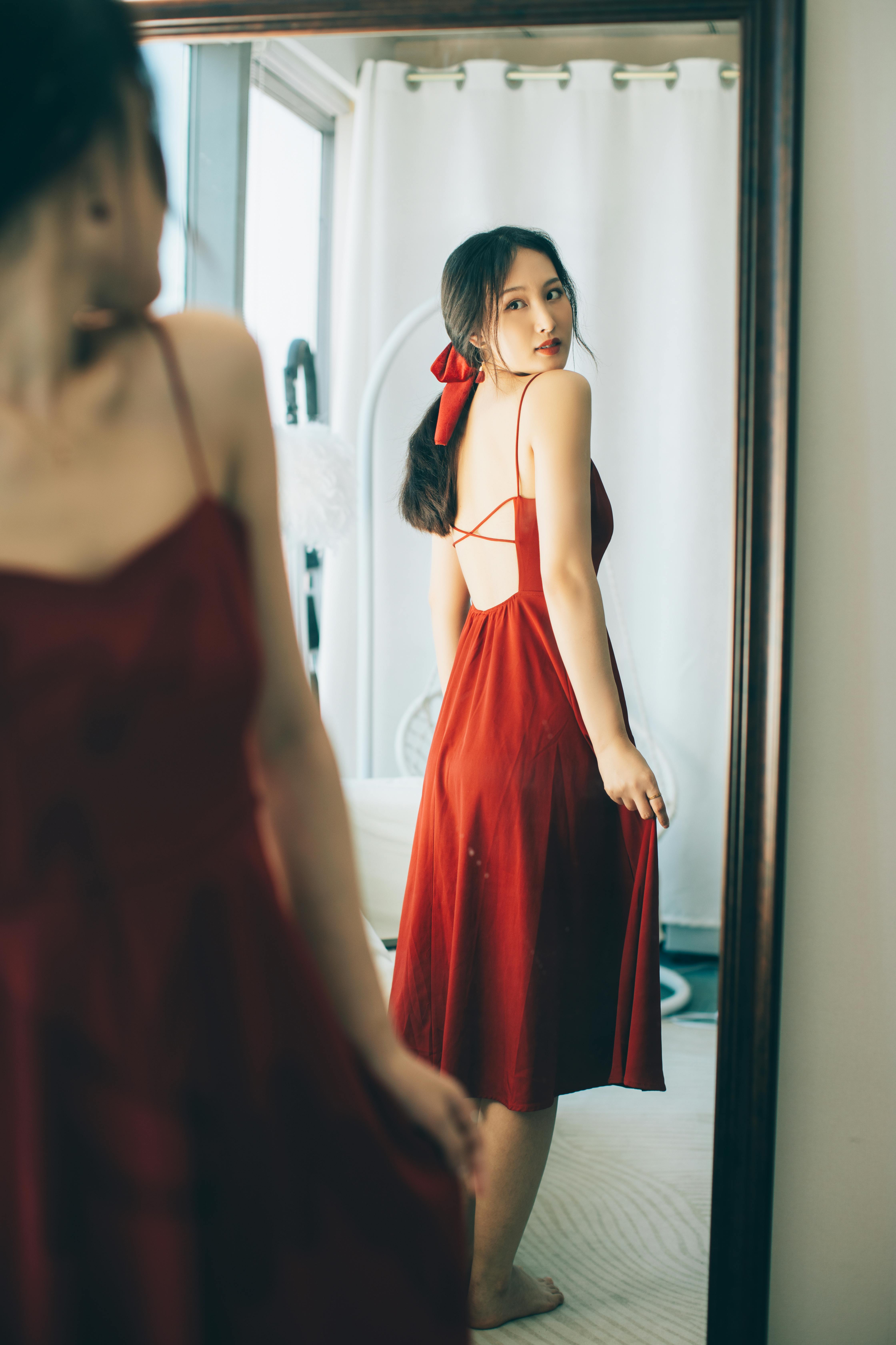 Reflection in Mirror of Woman in Red Dress · Free Stock Photo