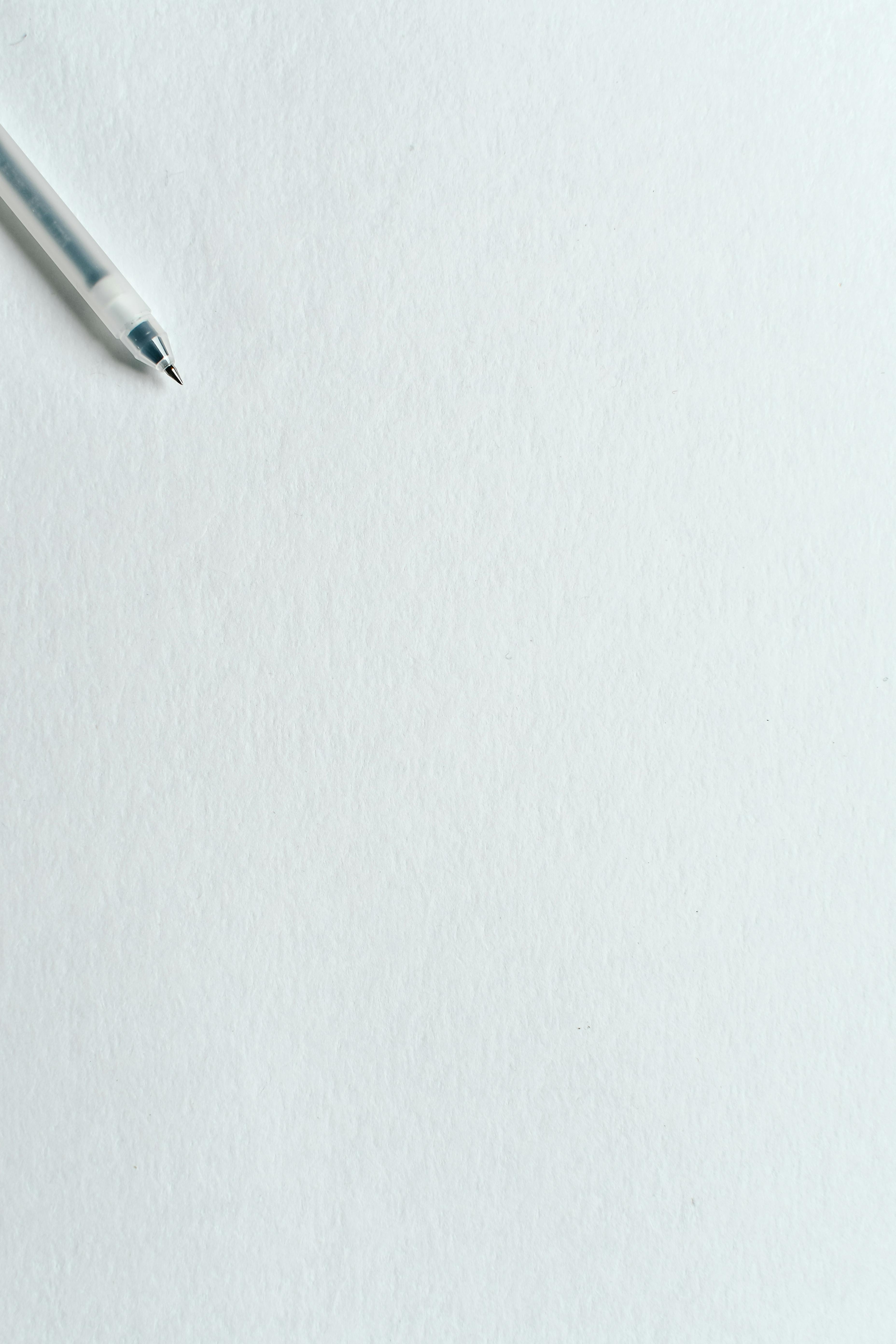 A Pen and a Blank Paper · Free Stock Photo