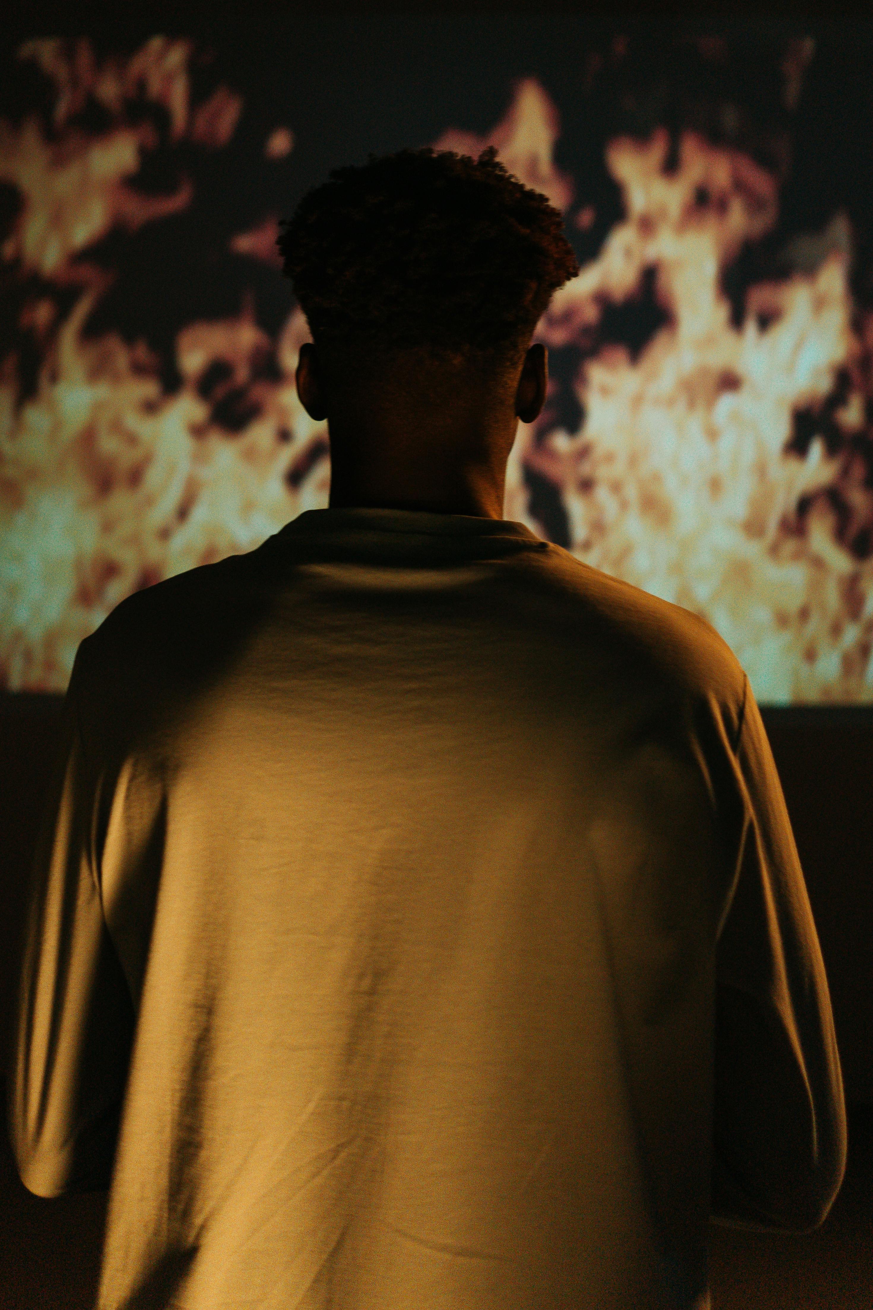 Woman Holding a Lit Lighter in Front of Her Face · Free Stock Photo