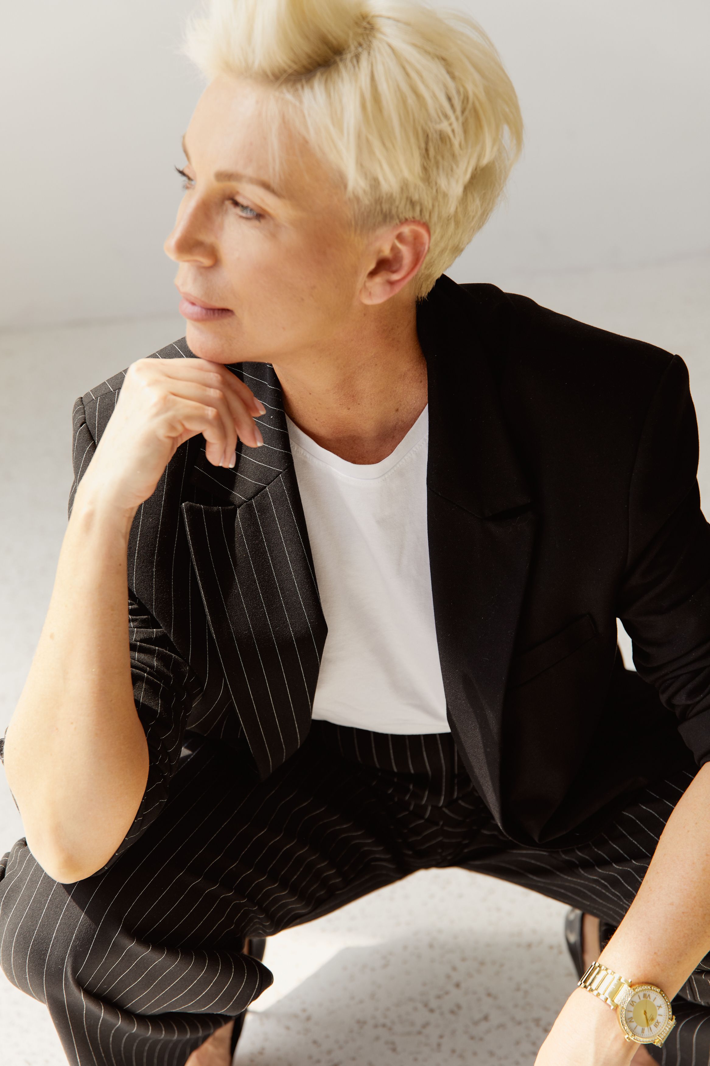 Woman Wearing Blazer with Her Hand on Her Chin · Free Stock Photo