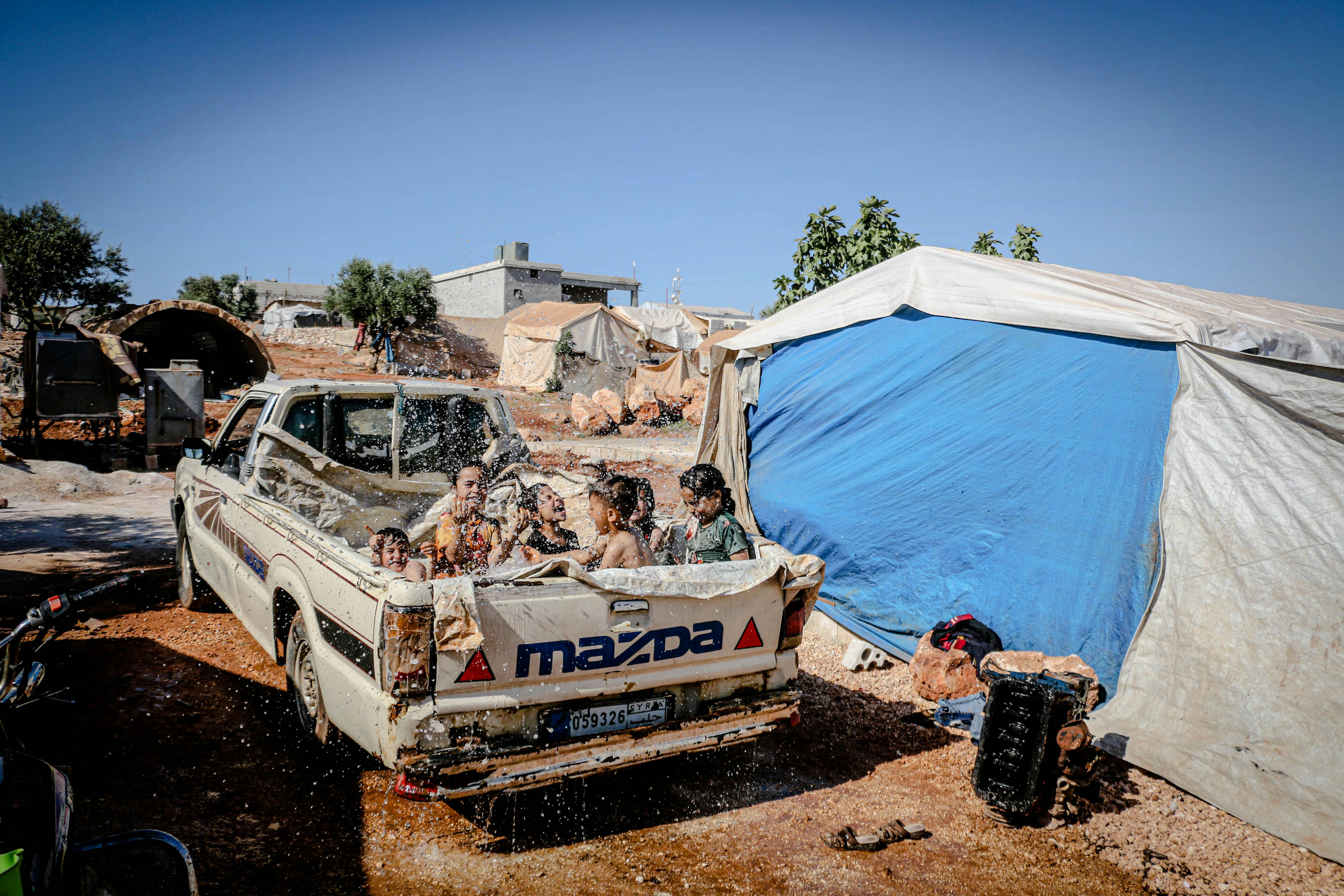 Kids Playing in the Trailer of a Car · Free Stock Photo