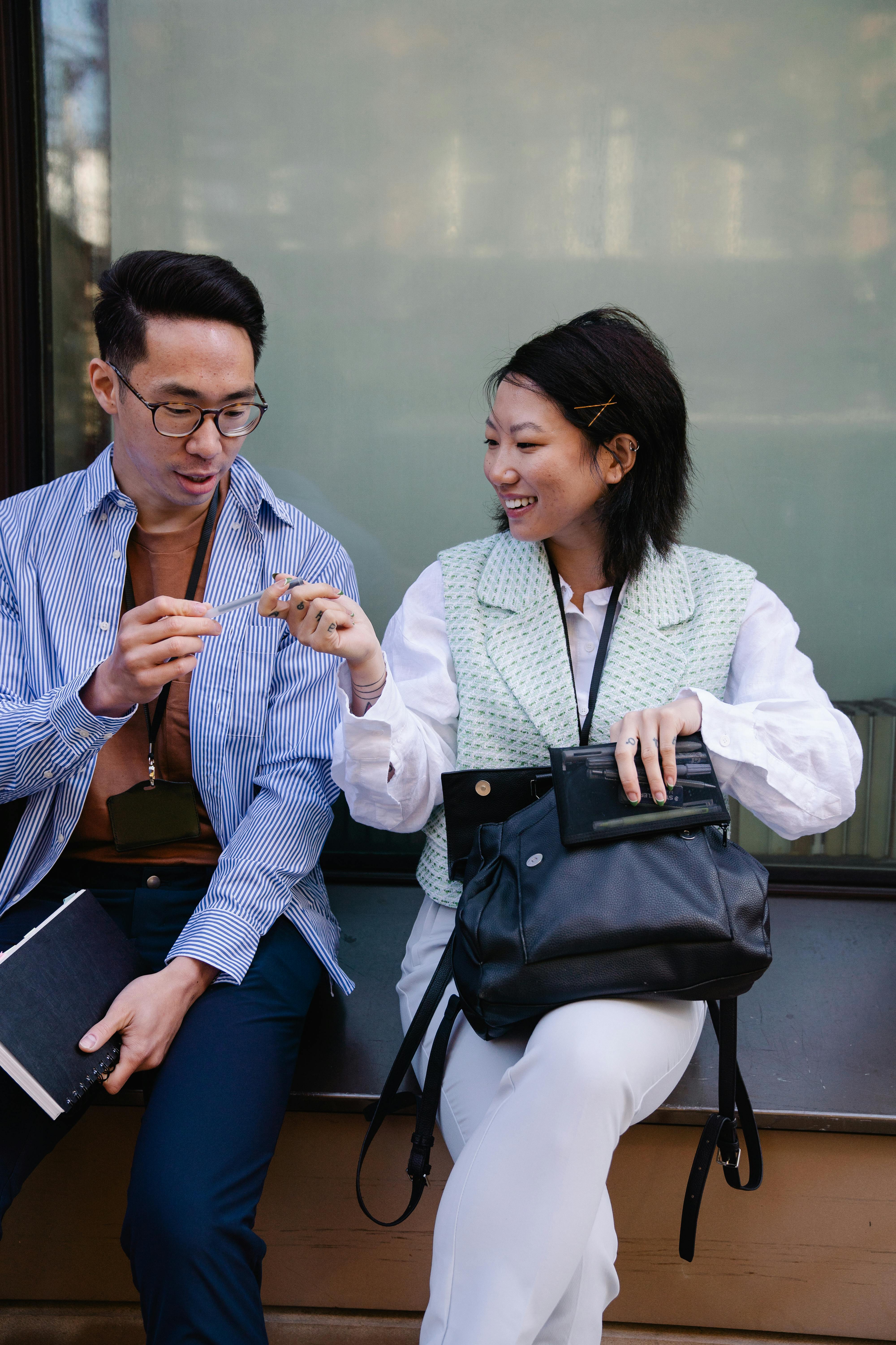 Two People sitting beside each other · Free Stock Photo