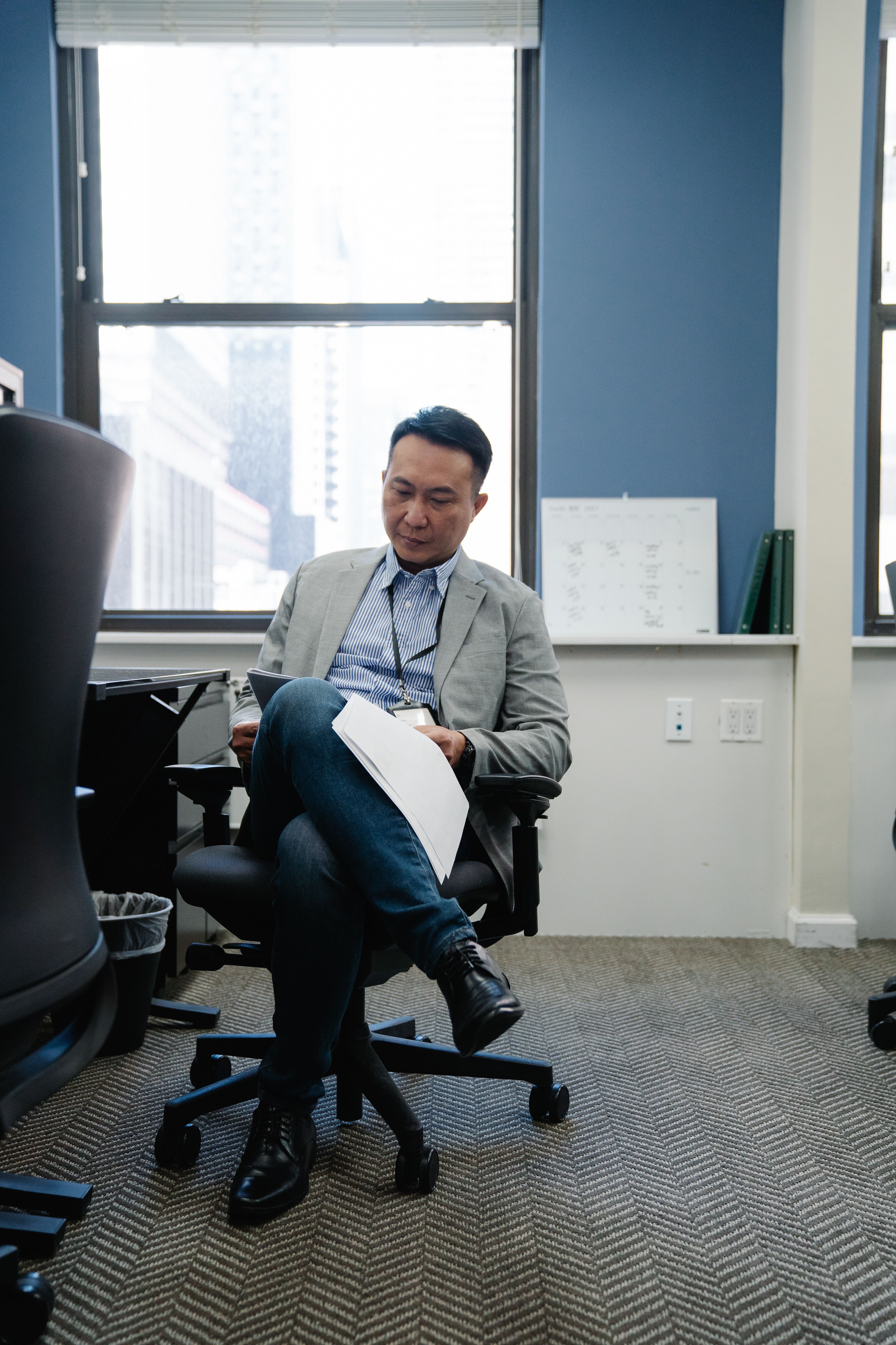 Male Employee looking at Documents · Free Stock Photo