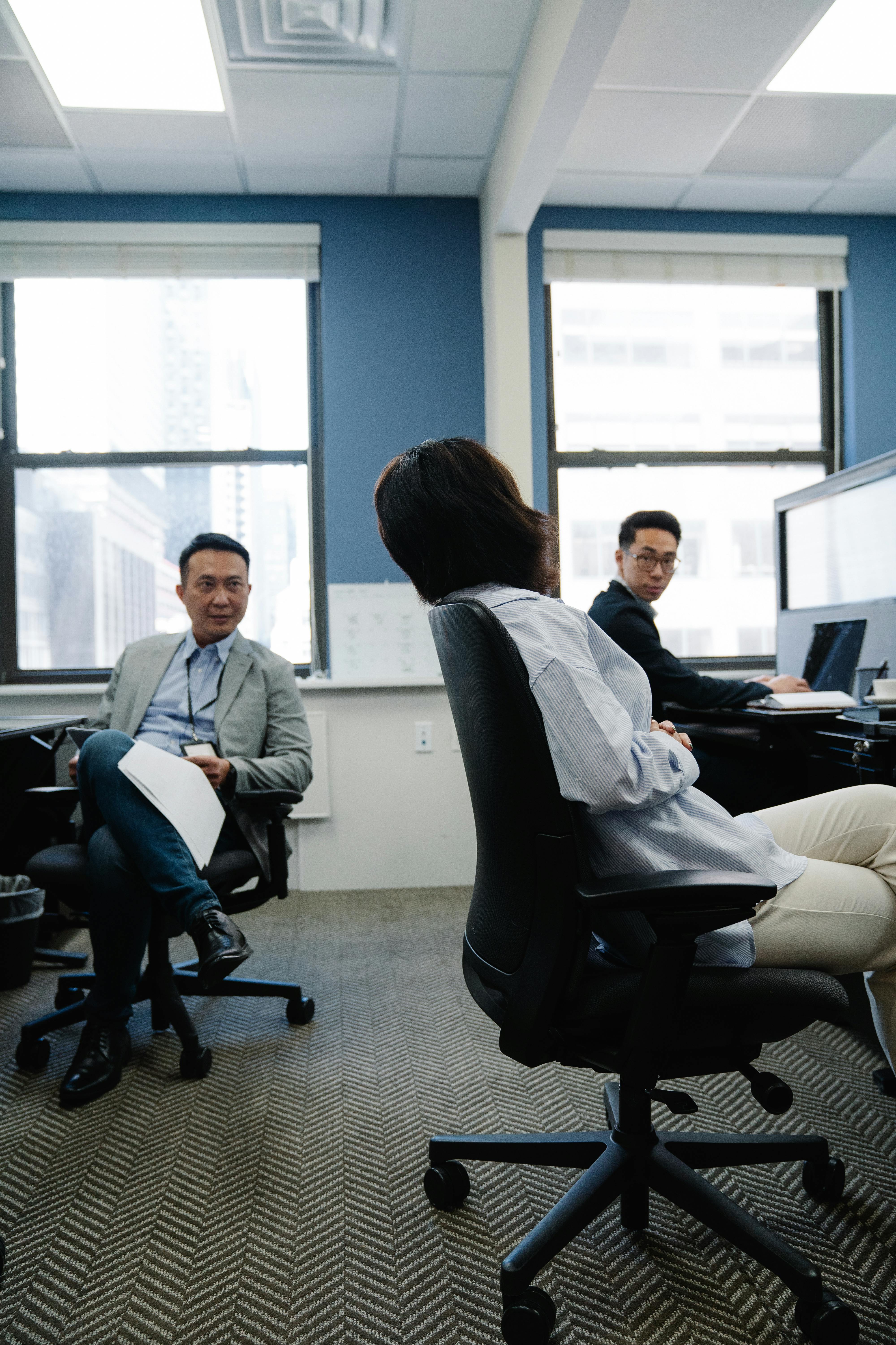A People Sitting in the Office · Free Stock Photo