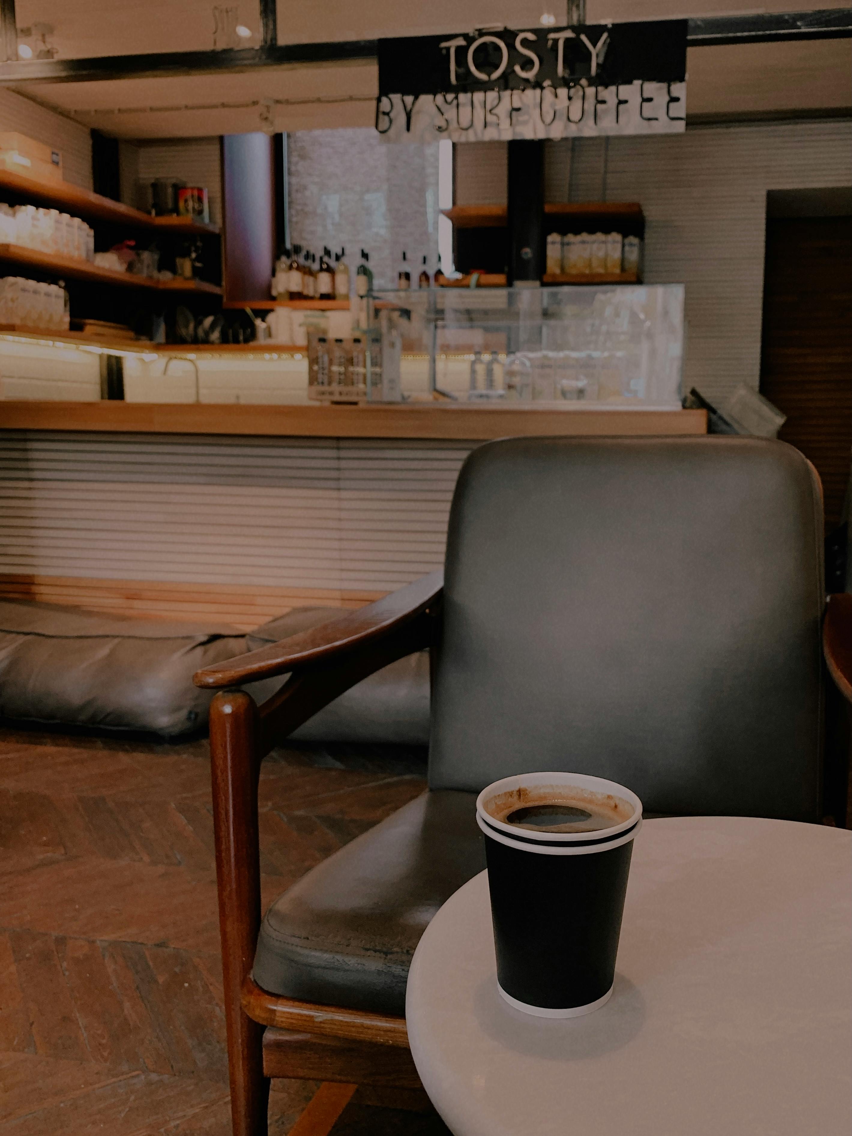 Black Paper Cup on the Table · Free Stock Photo