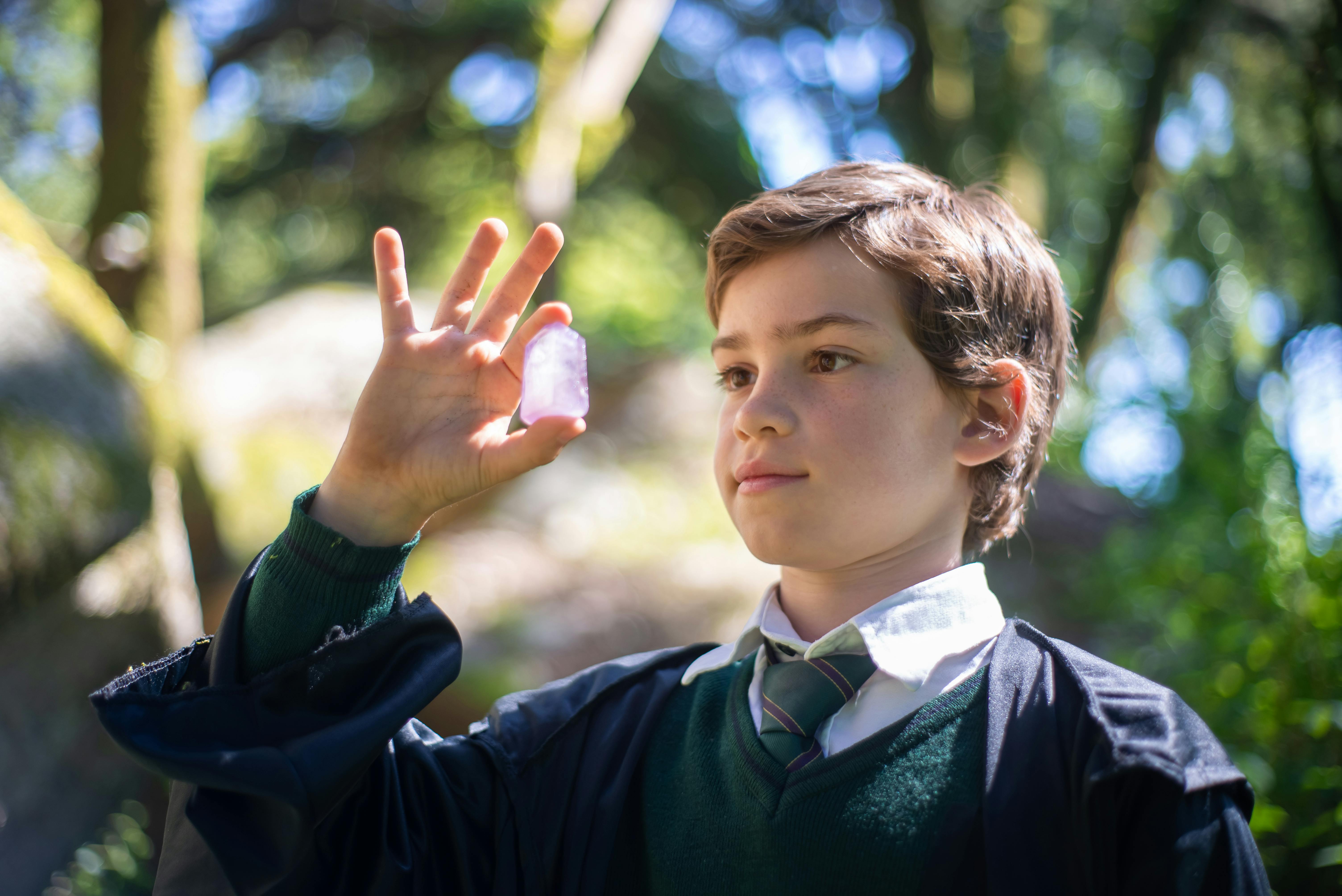 A Boy Holding a Stone · Free Stock Photo