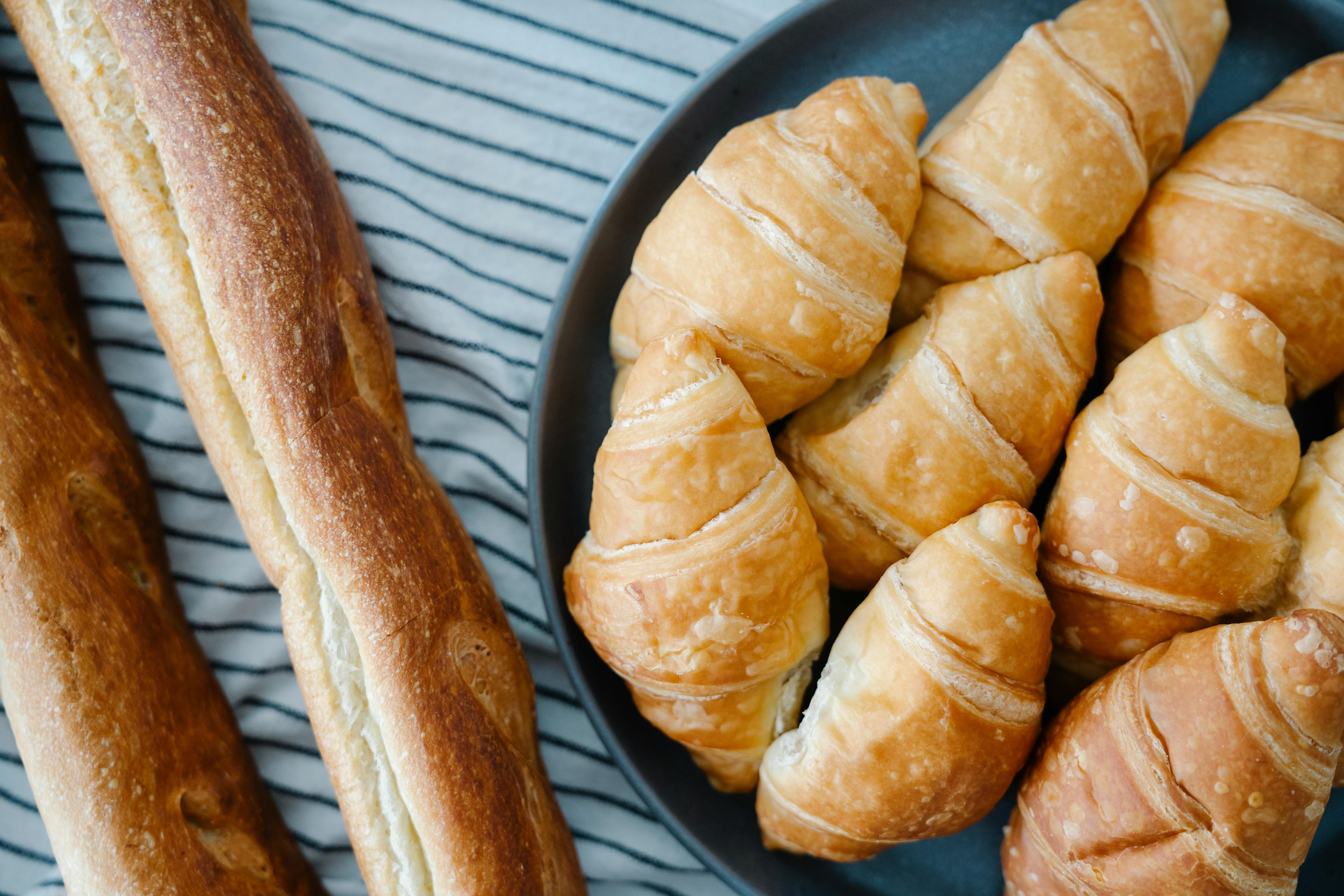 Top View of Croissants and Baguettes on a Striped Tablecloth · Free ...