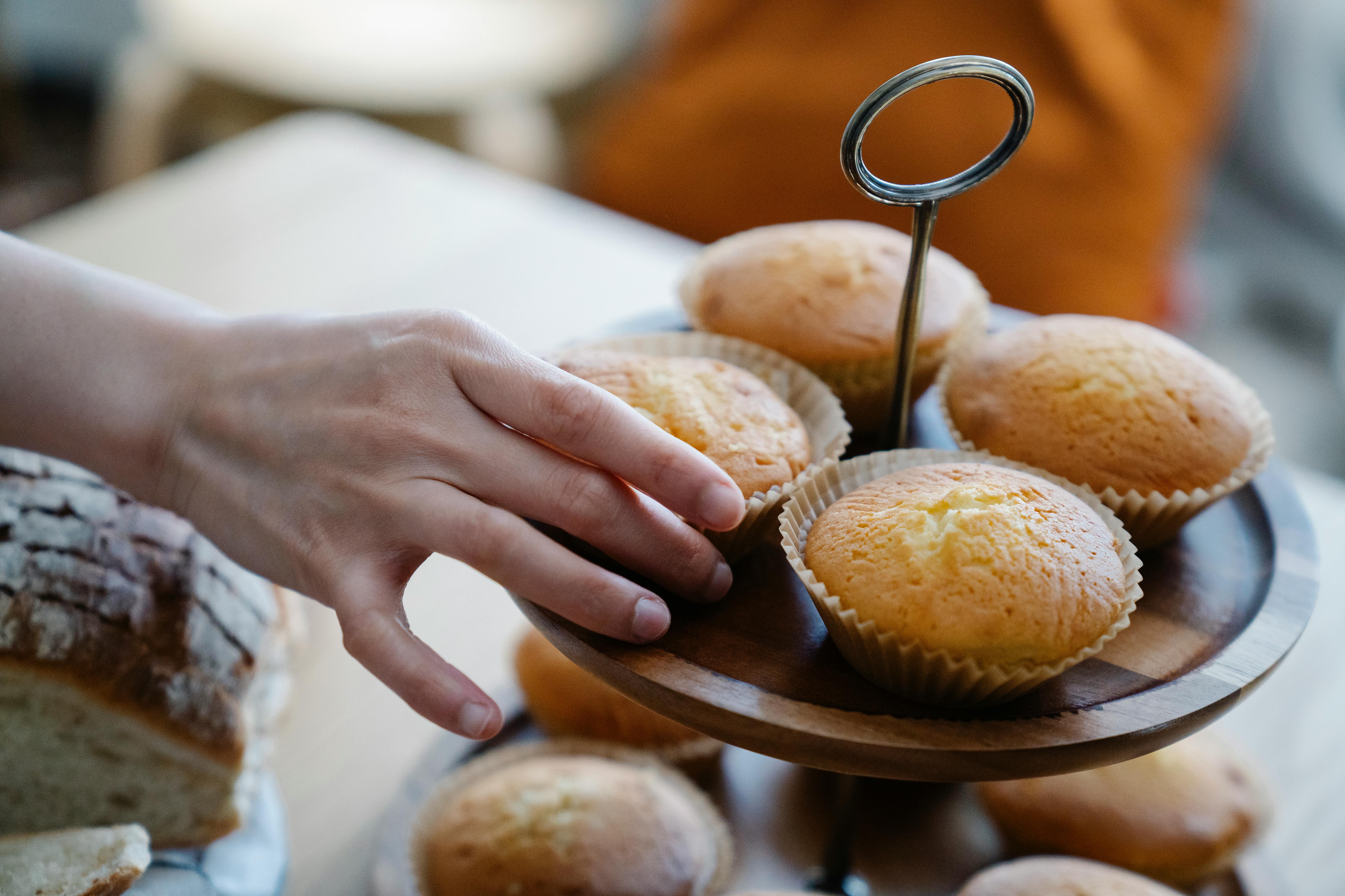 Hand Touching Cake · Free Stock Photo