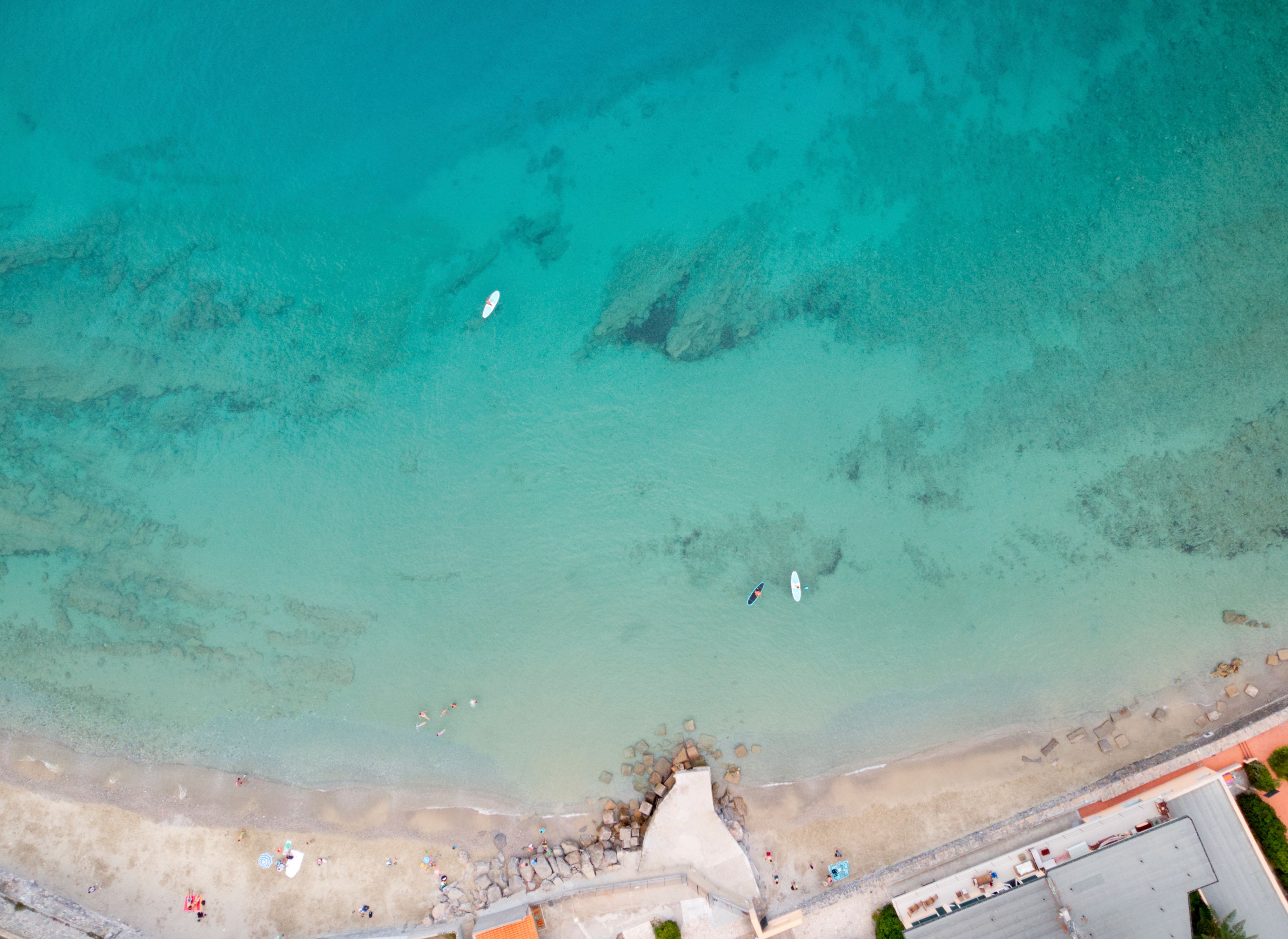 Person Bathing in Turquoise Water · Free Stock Photo